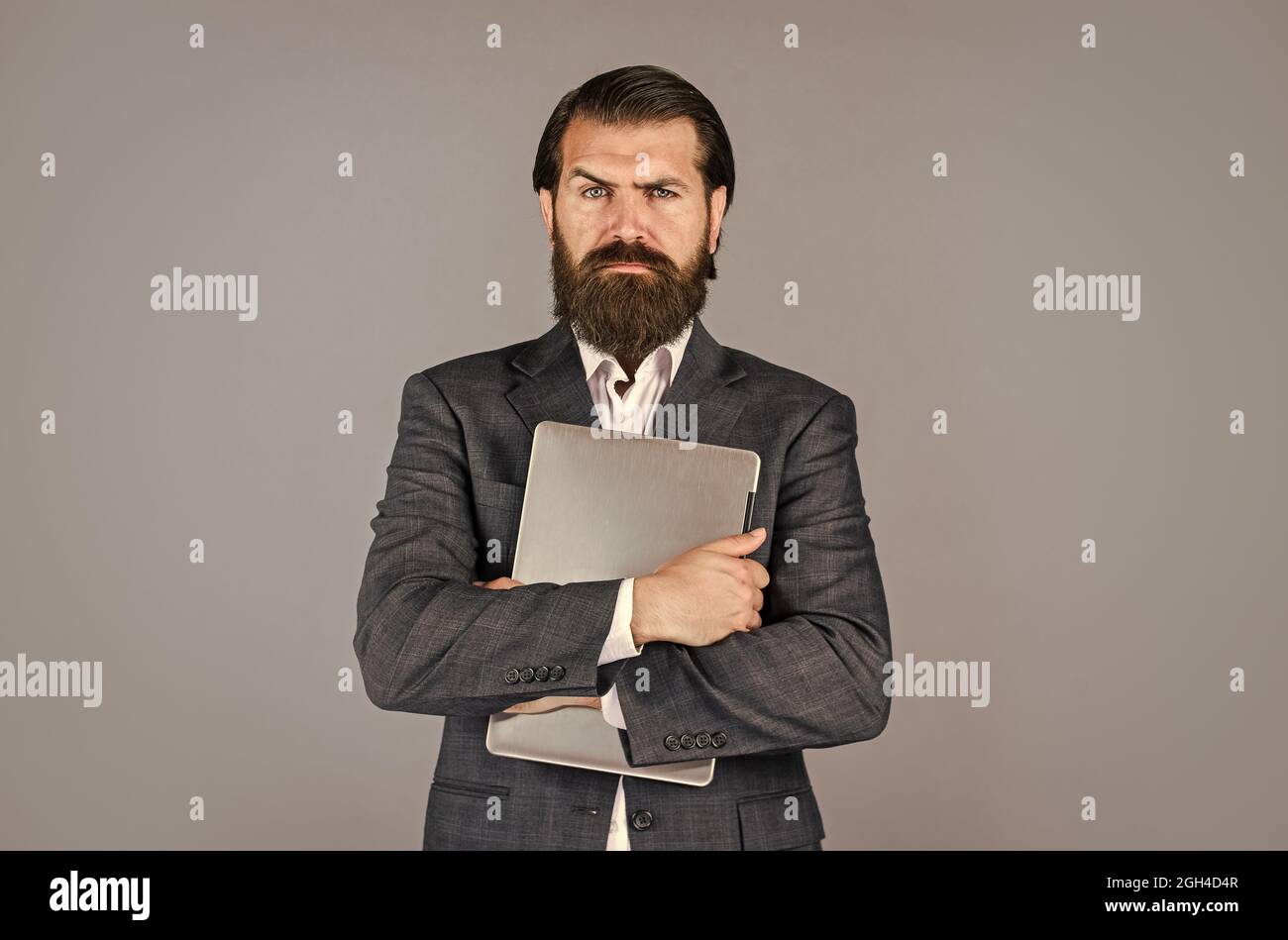 this is my computer. handsome ceo hold computer. boss and employee ...