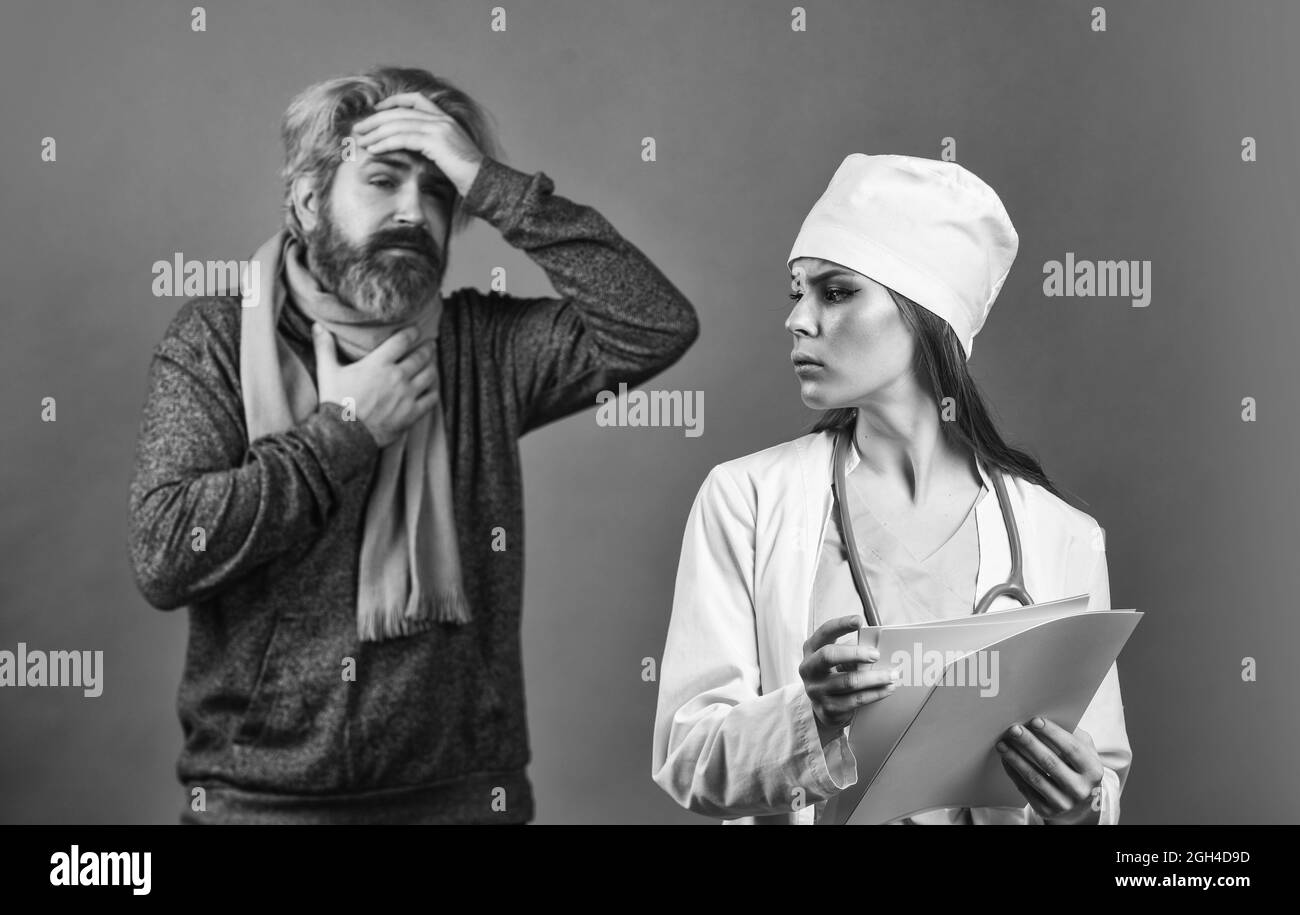 Nurse visiting unhealthy man at home. Cold flu symptoms. Virus epidemic ...