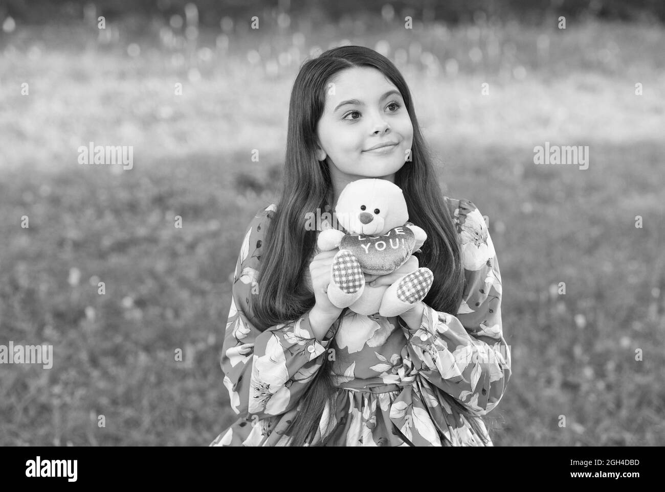 Girl kid hug soft toy teddy bear love symbol, kindness and charity ...