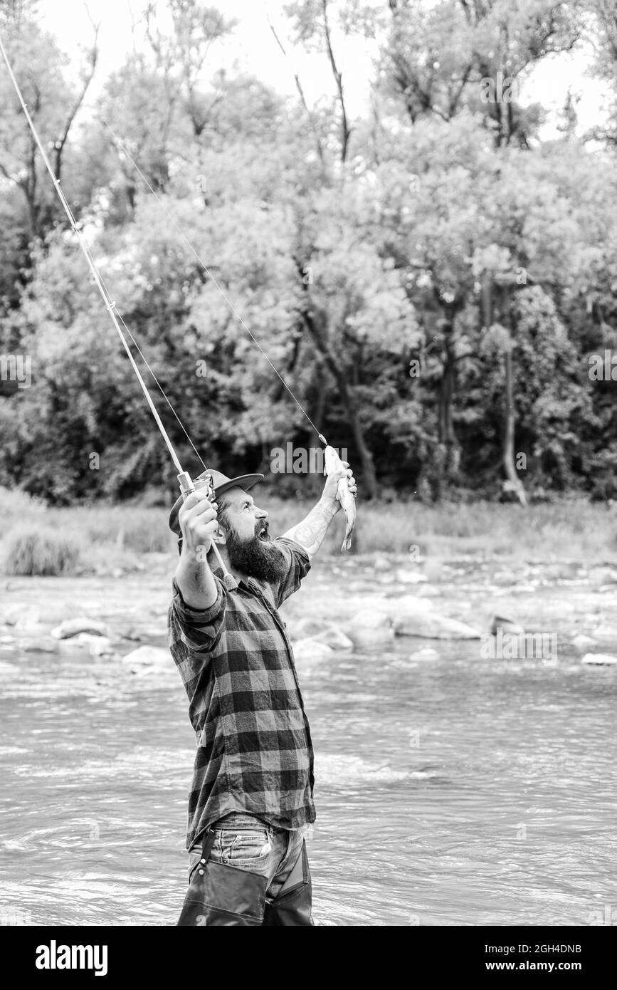 celebrationg success. summer weekend. Happy fly fishing. mature man fly ...