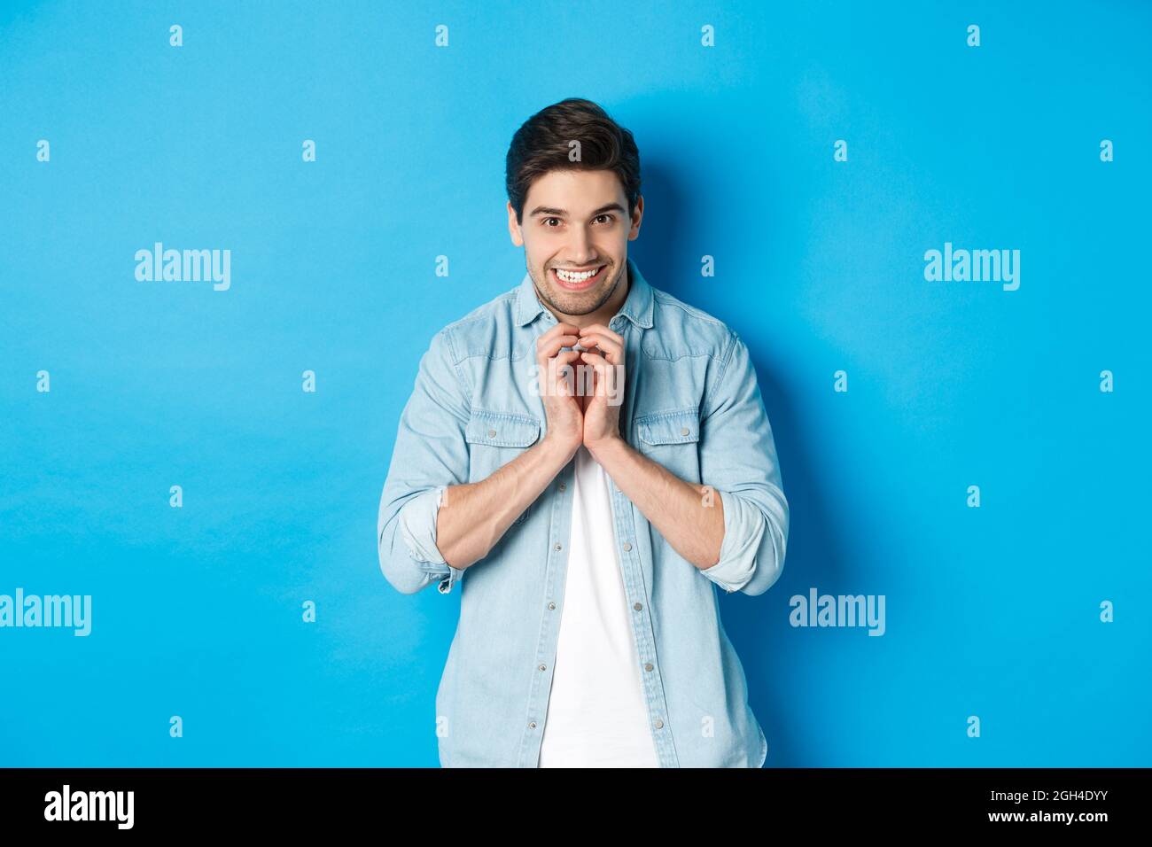 Funny cunning man having evil plan, scheming something and smiling ...