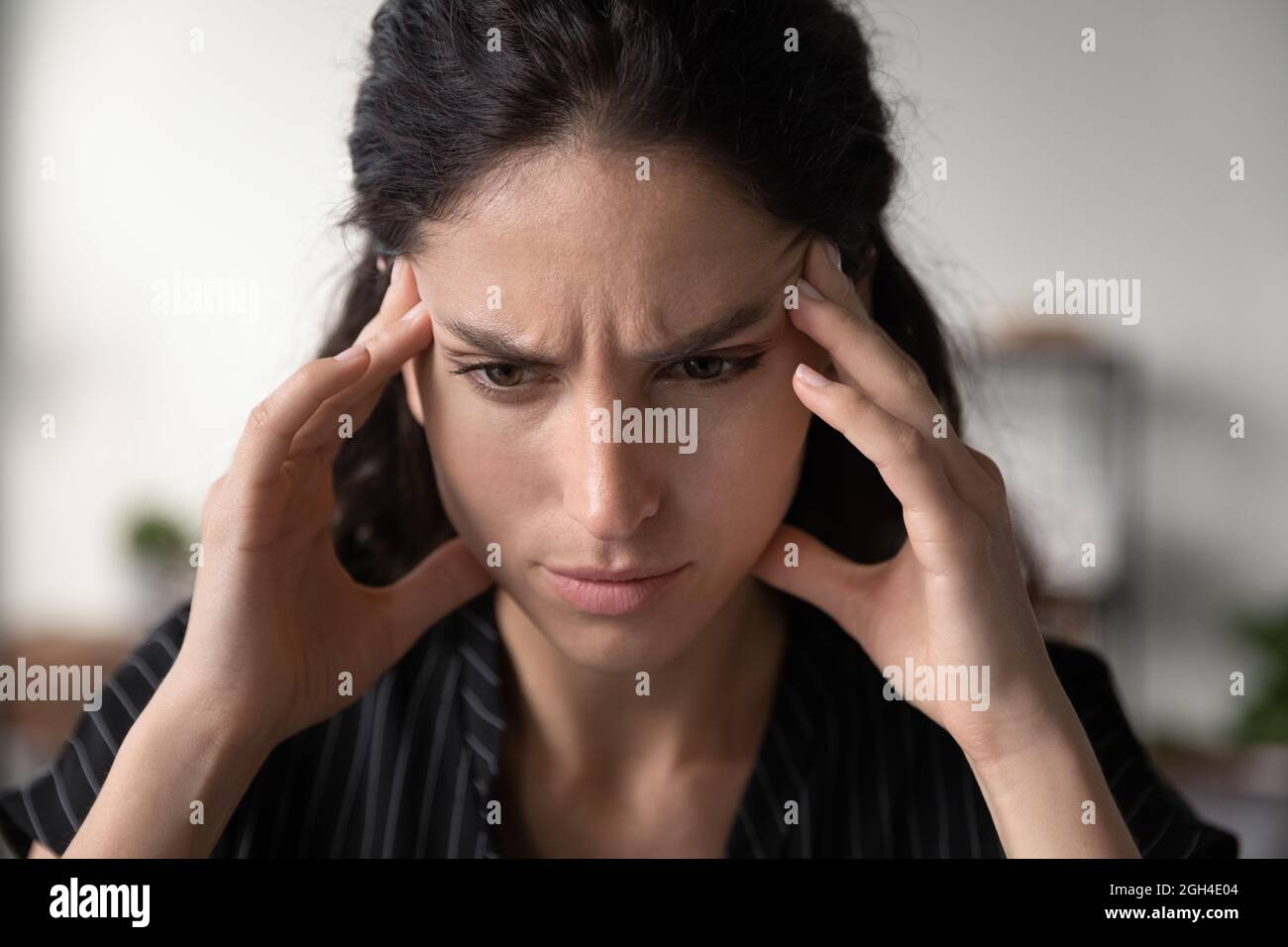 Stressed focused woman thinking hard, trying to remember important ...