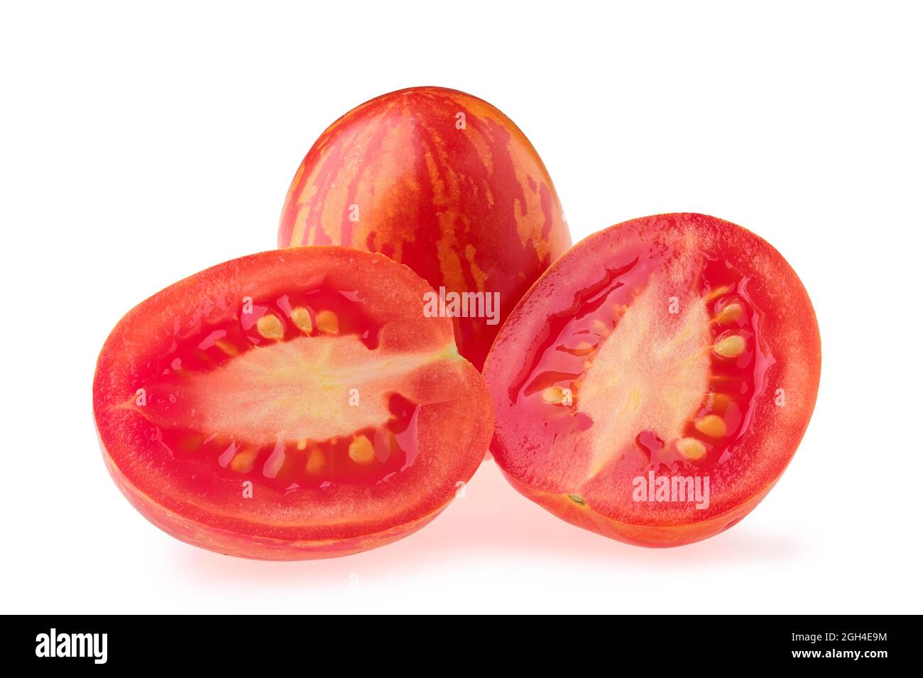 Fresh whole and half tomatoes Russian queen isolated on white ...