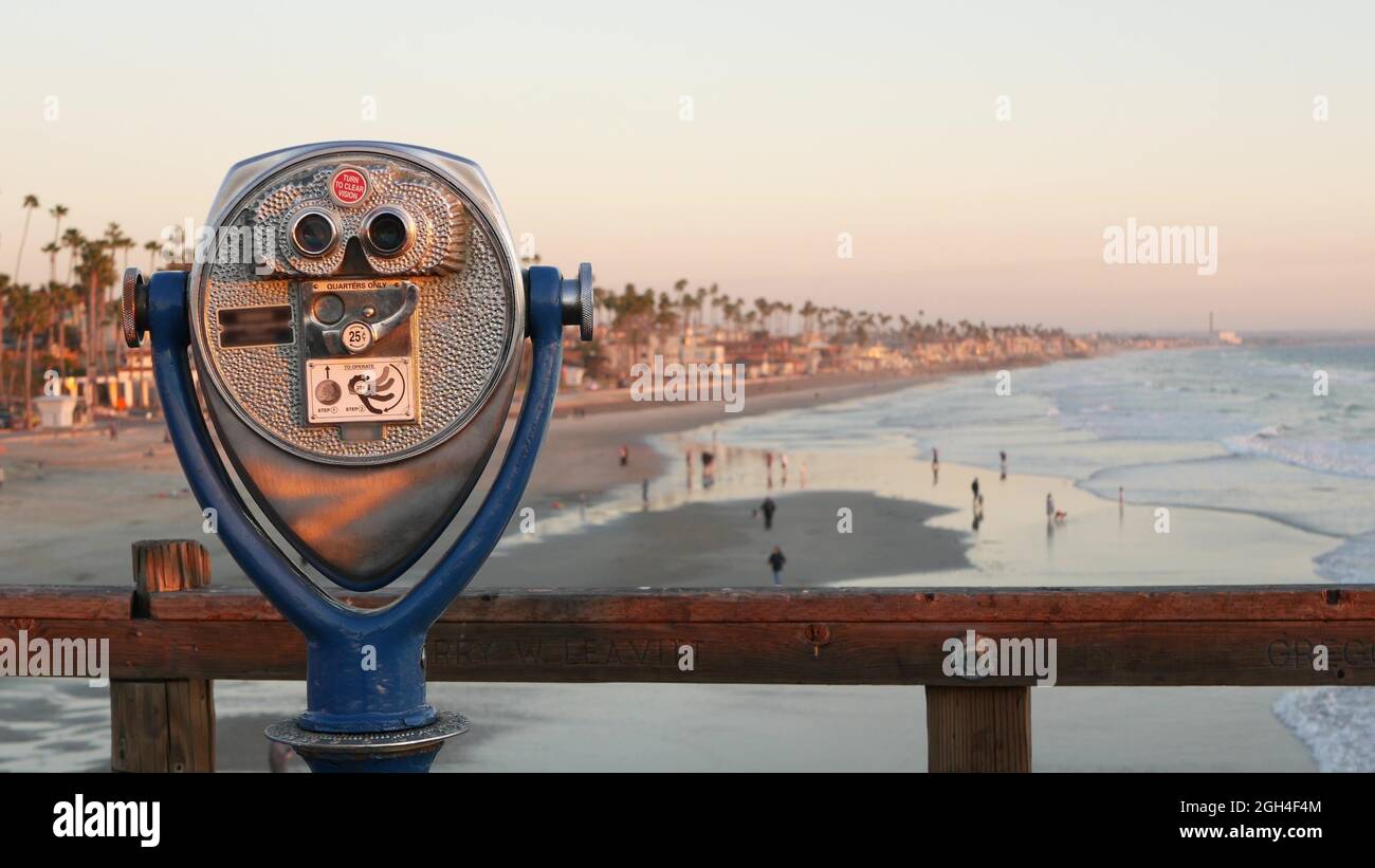 Metallic stationary observation tower viewer, waterfront old binoculars ...