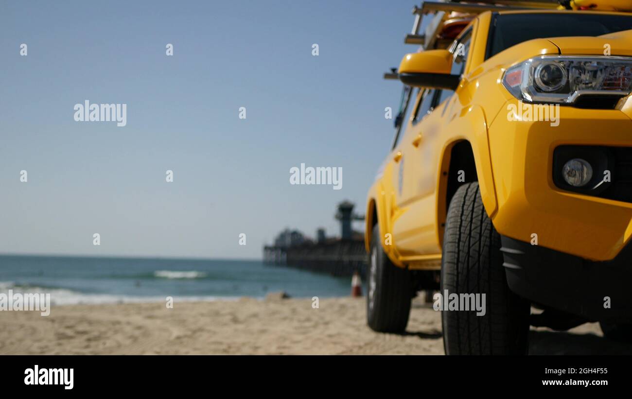 Yellow lifeguard car, Oceanside beach, California USA. Coastline rescue ...