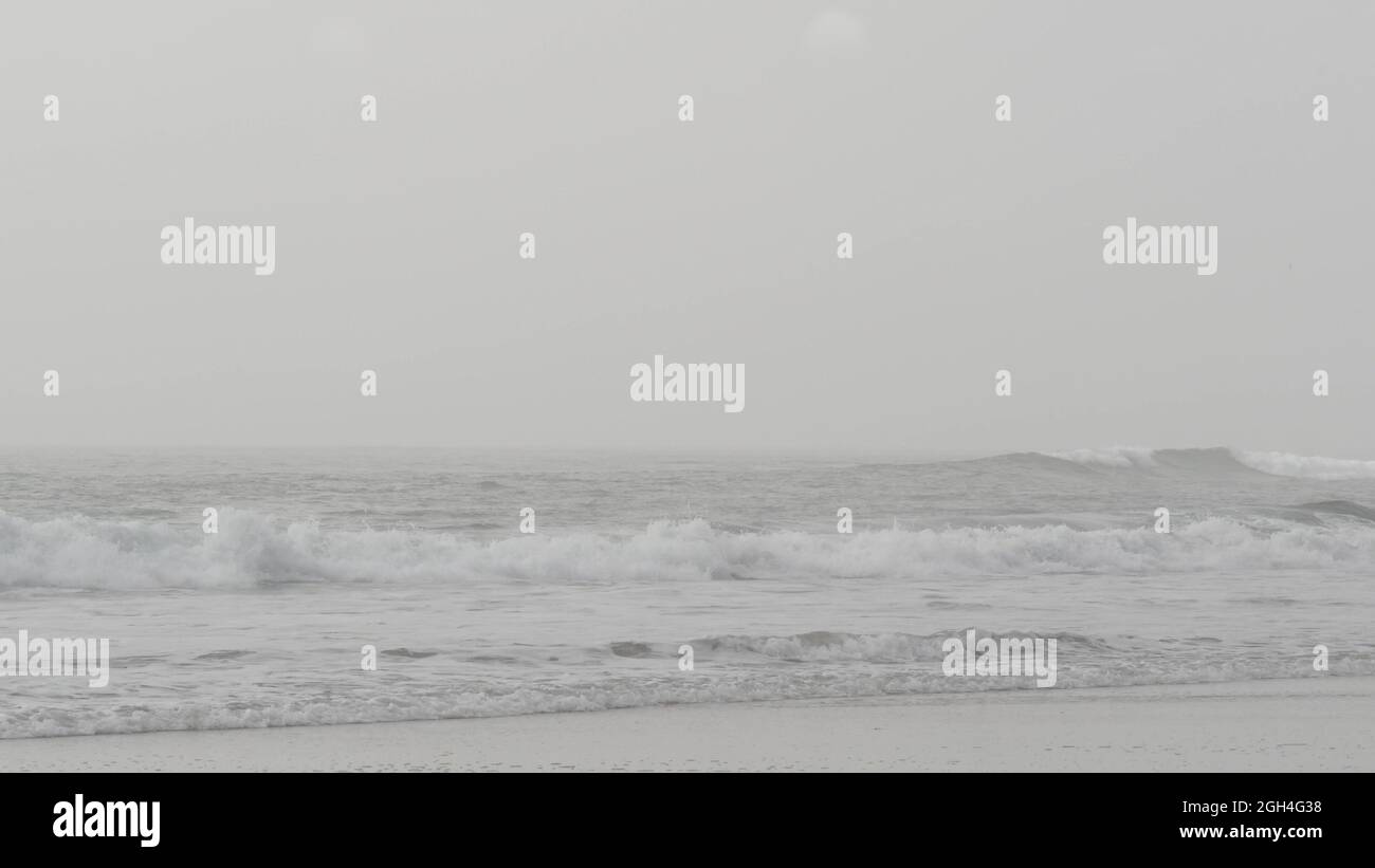 Sandy misty beach, Encinitas California USA. Pacific ocean coast, dense ...