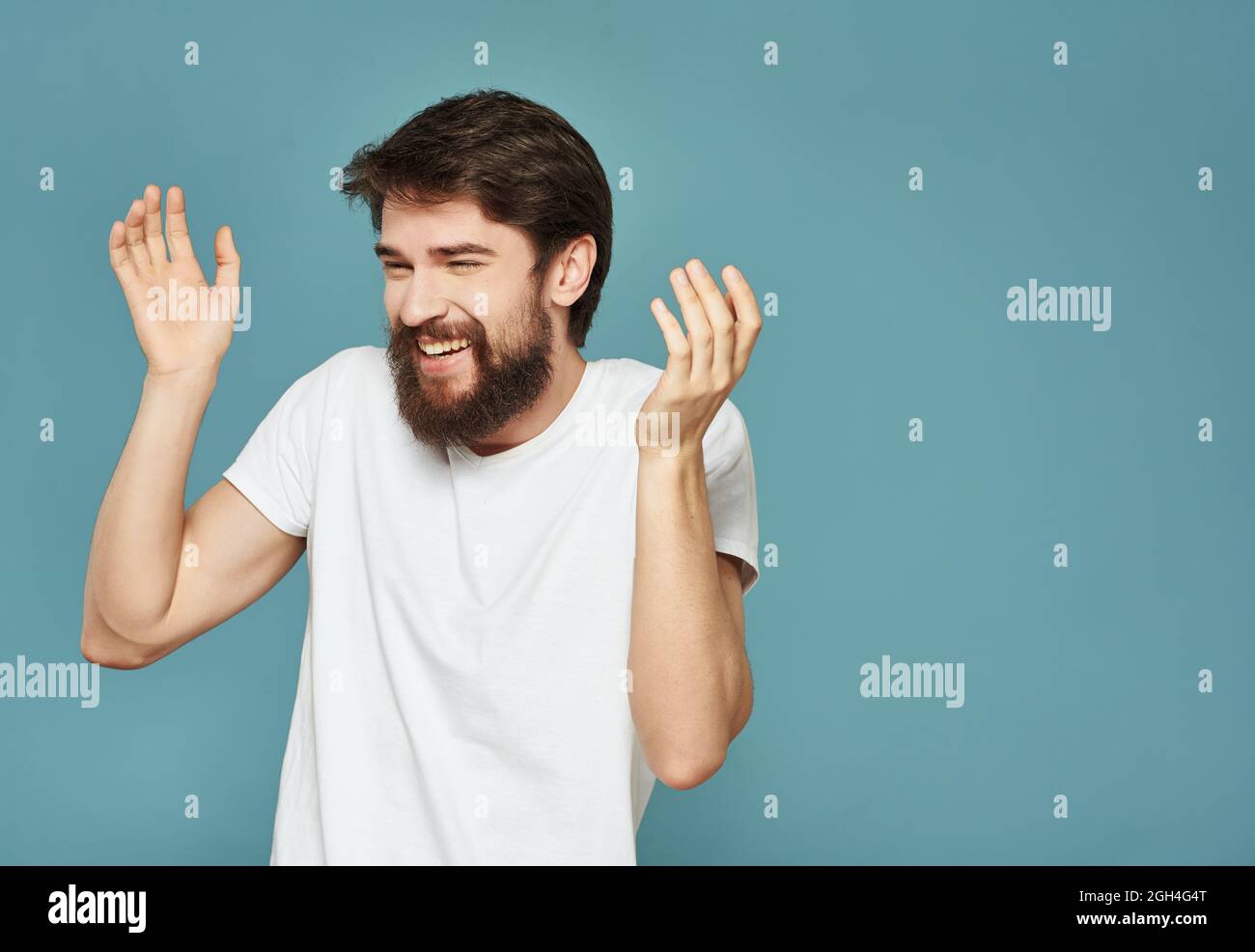 emotional man in a white t-shirt irritated facial expression Lifestyle ...