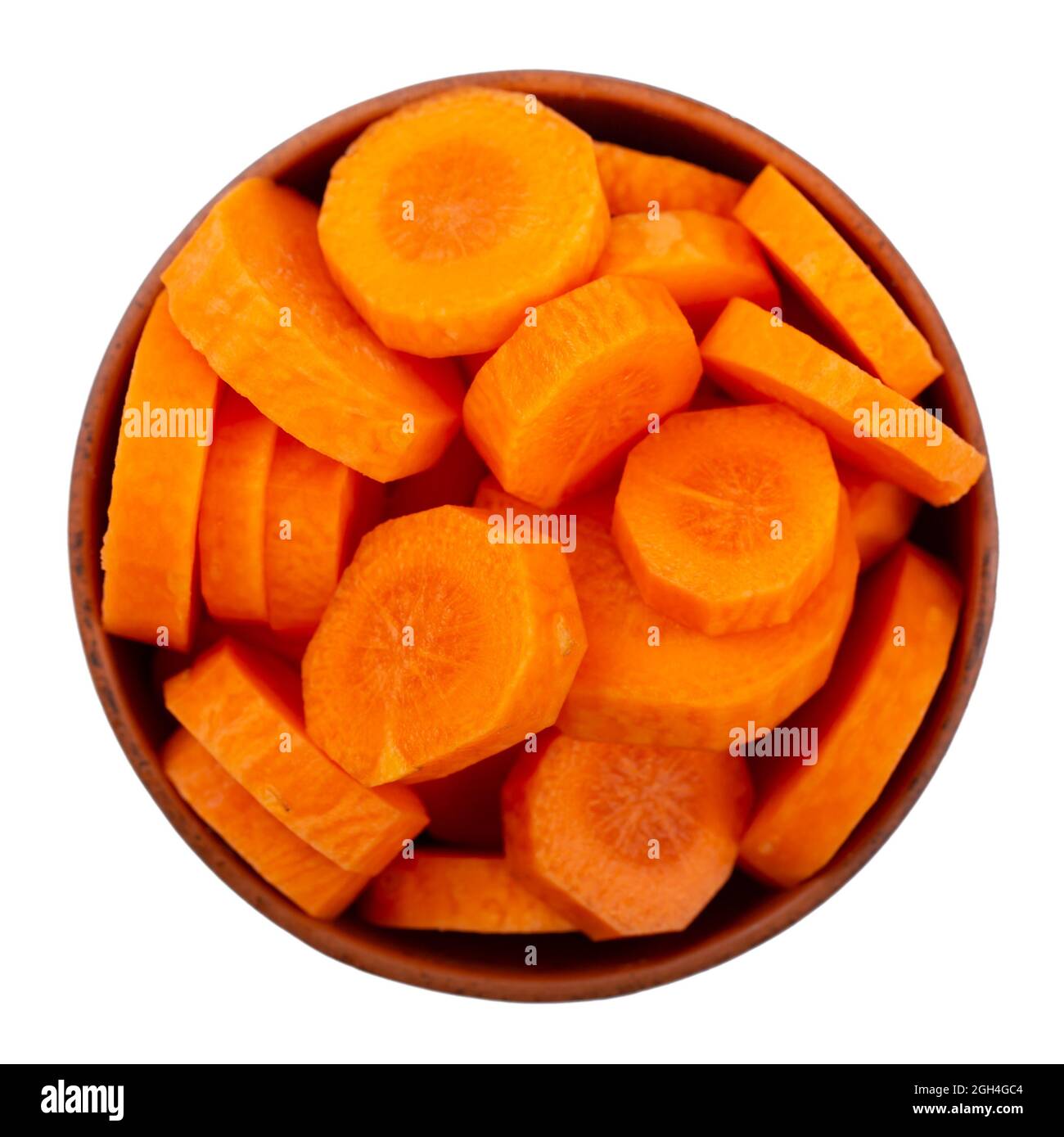 Sliced carrots in a bowl Isolated on white background. Fresh cut crisp ...