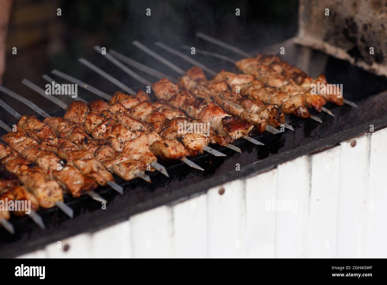Shashlik traditional russian barbecue. Pork Shish kebab on Fire grill ...