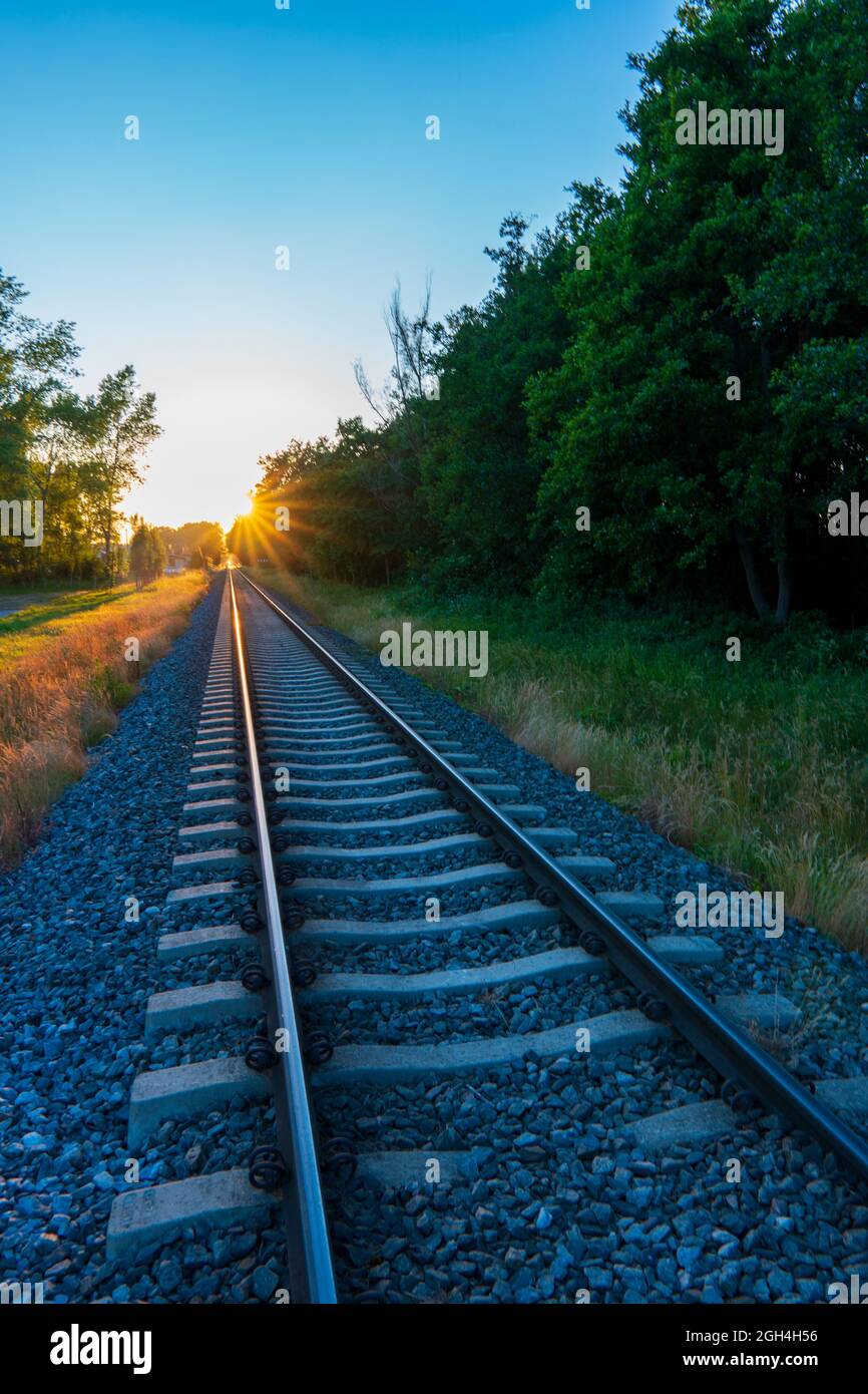 daily life of a woman walking along the rail track Stock Photo - Alamy