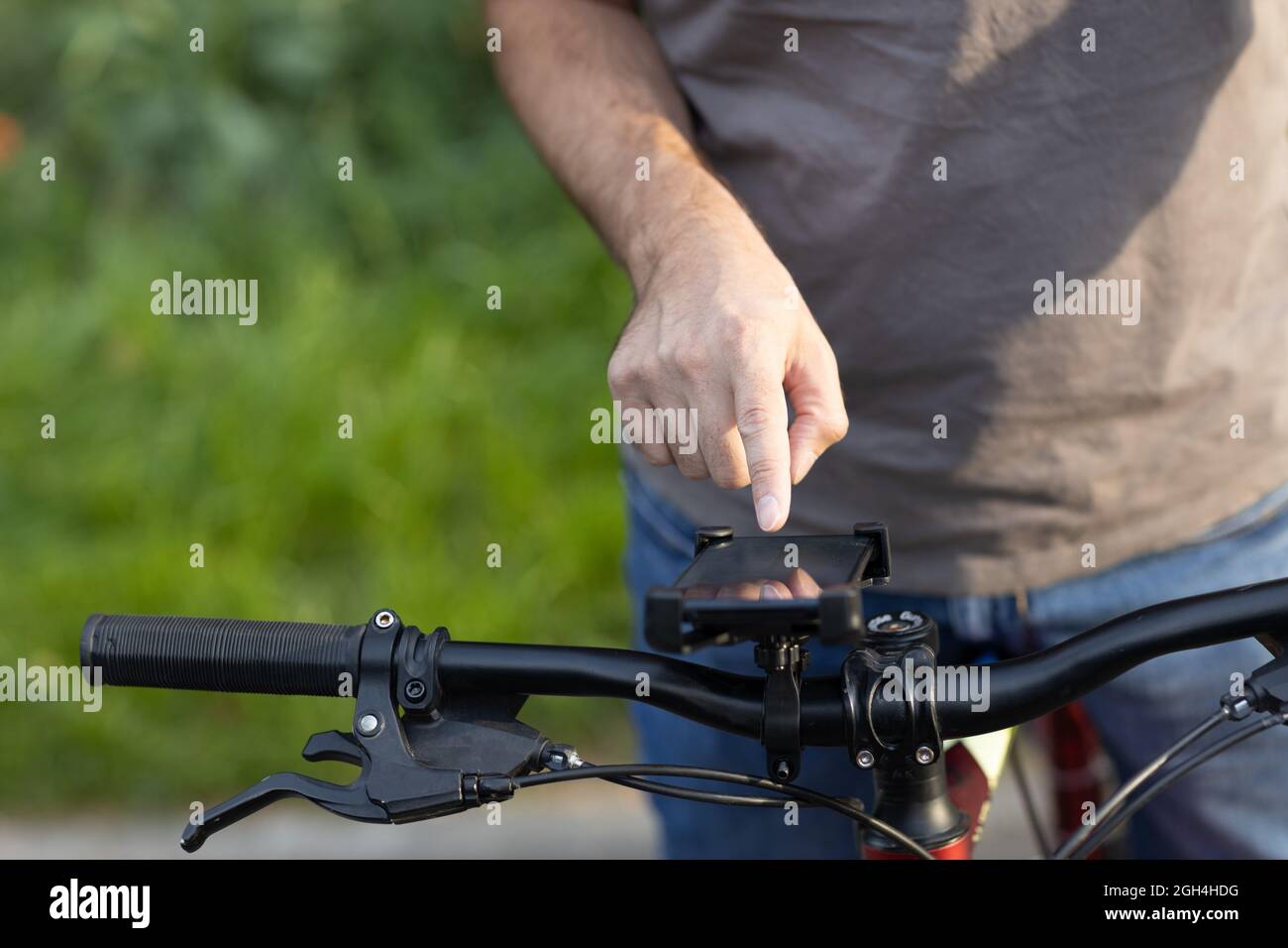 Man planning route using GPS navigation application in mobile phone on ...