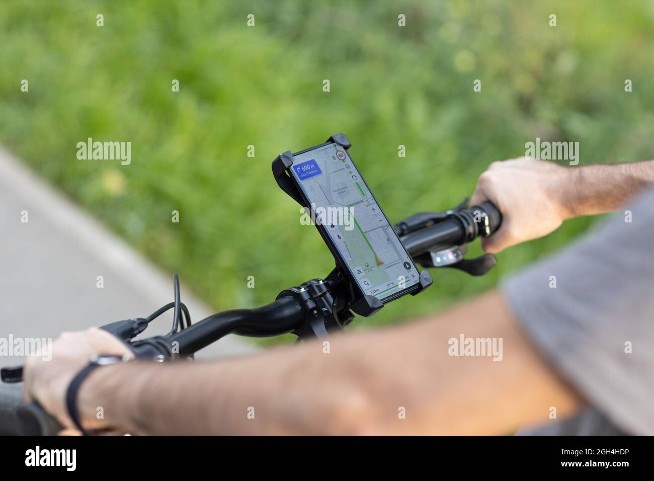 Man planning route using GPS navigation application in mobile phone on ...