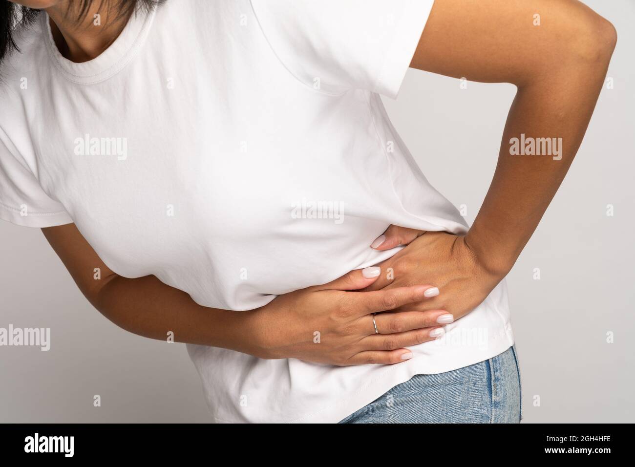 Sick woman touching left side suffer from acute abdominal pain in ...