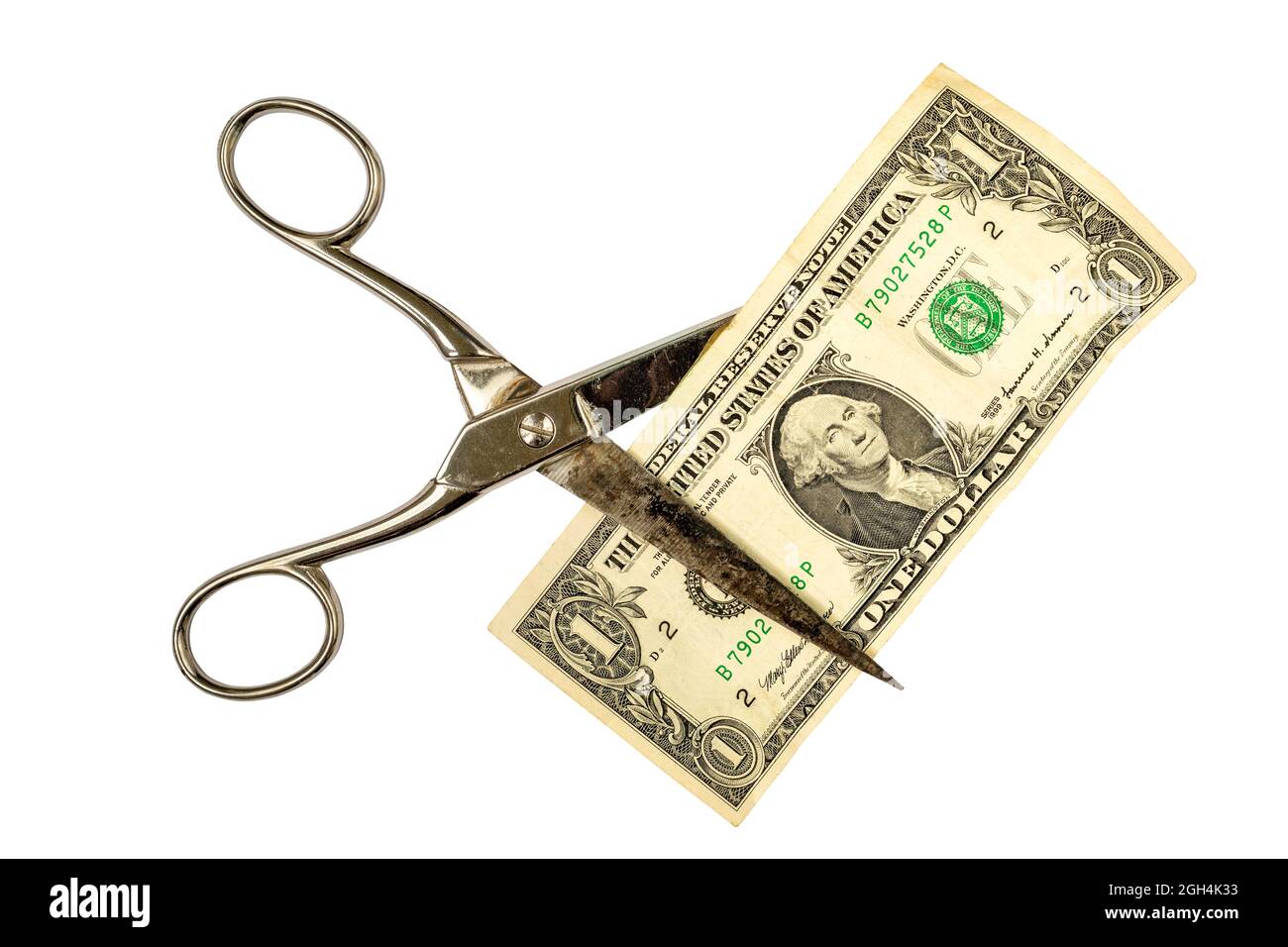 Cutting one dollar with scissors, isolated on white background Stock ...