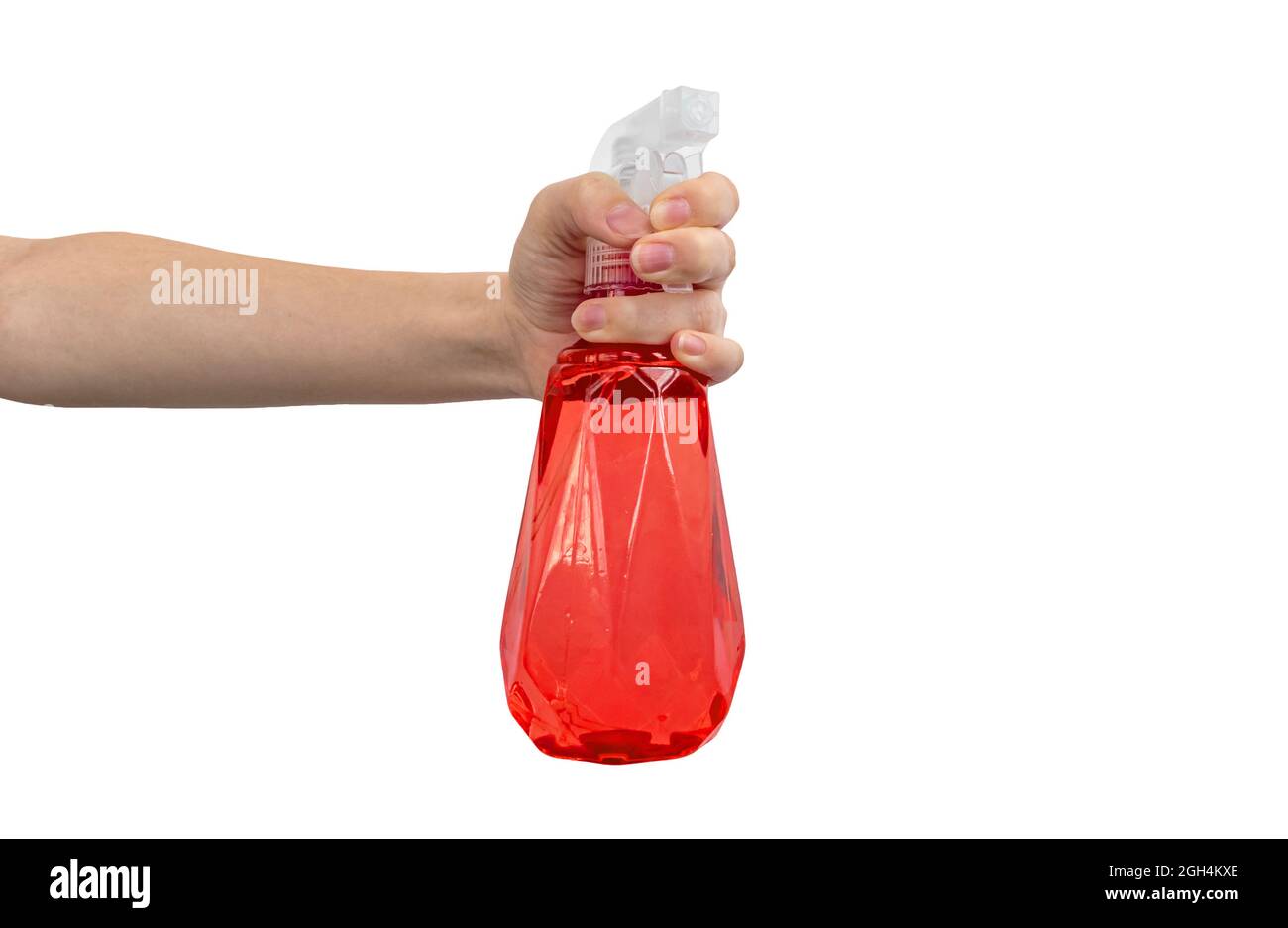 Female hand holding red spray bottle isolated on a white background ...