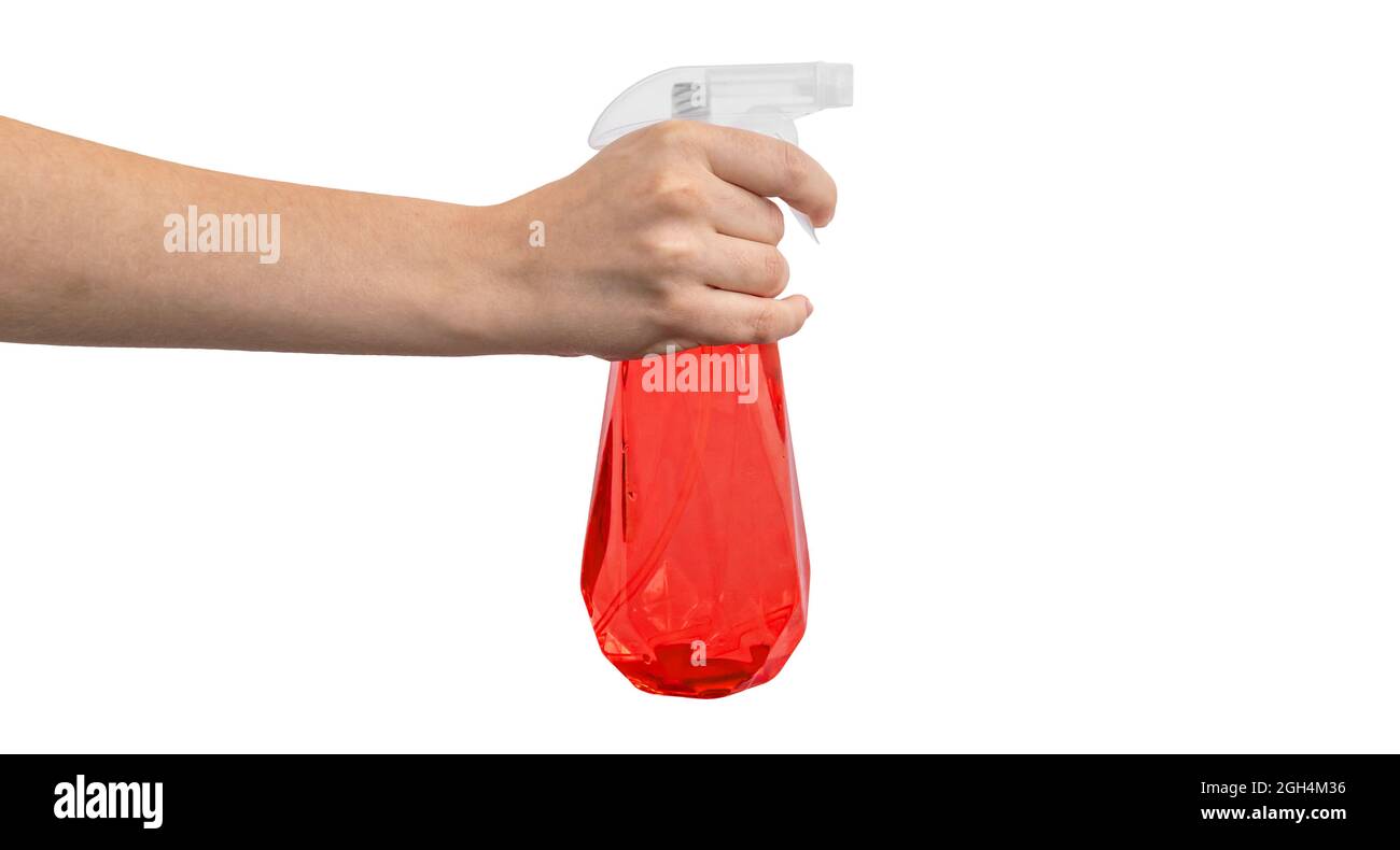 Hand using spray bottle with water isolated on a white background photo ...