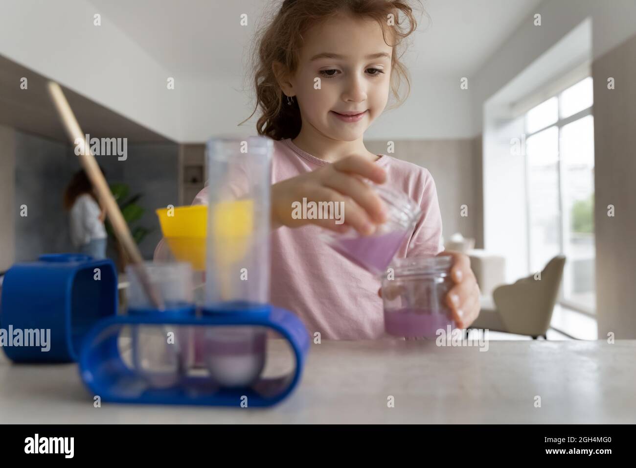 Smiling cute clever child making chemical experiments Stock Photo - Alamy