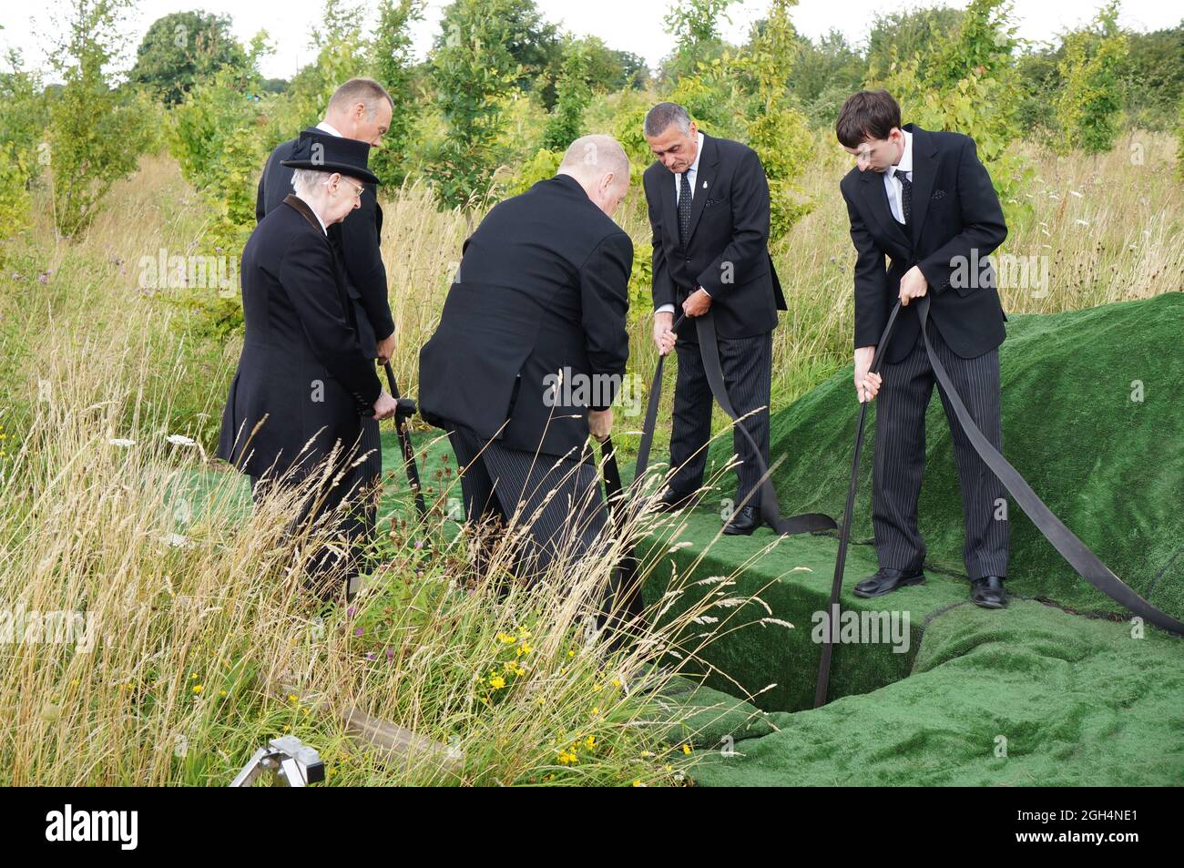 Undertakers performing a non-religious open burial funeral in BOSTON ...