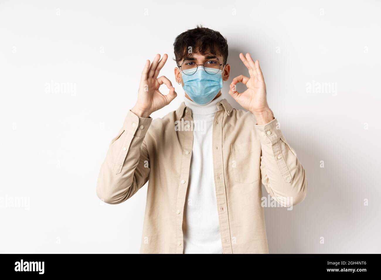 Covid-19, health and real people concept. Handsome guy in glasses and ...