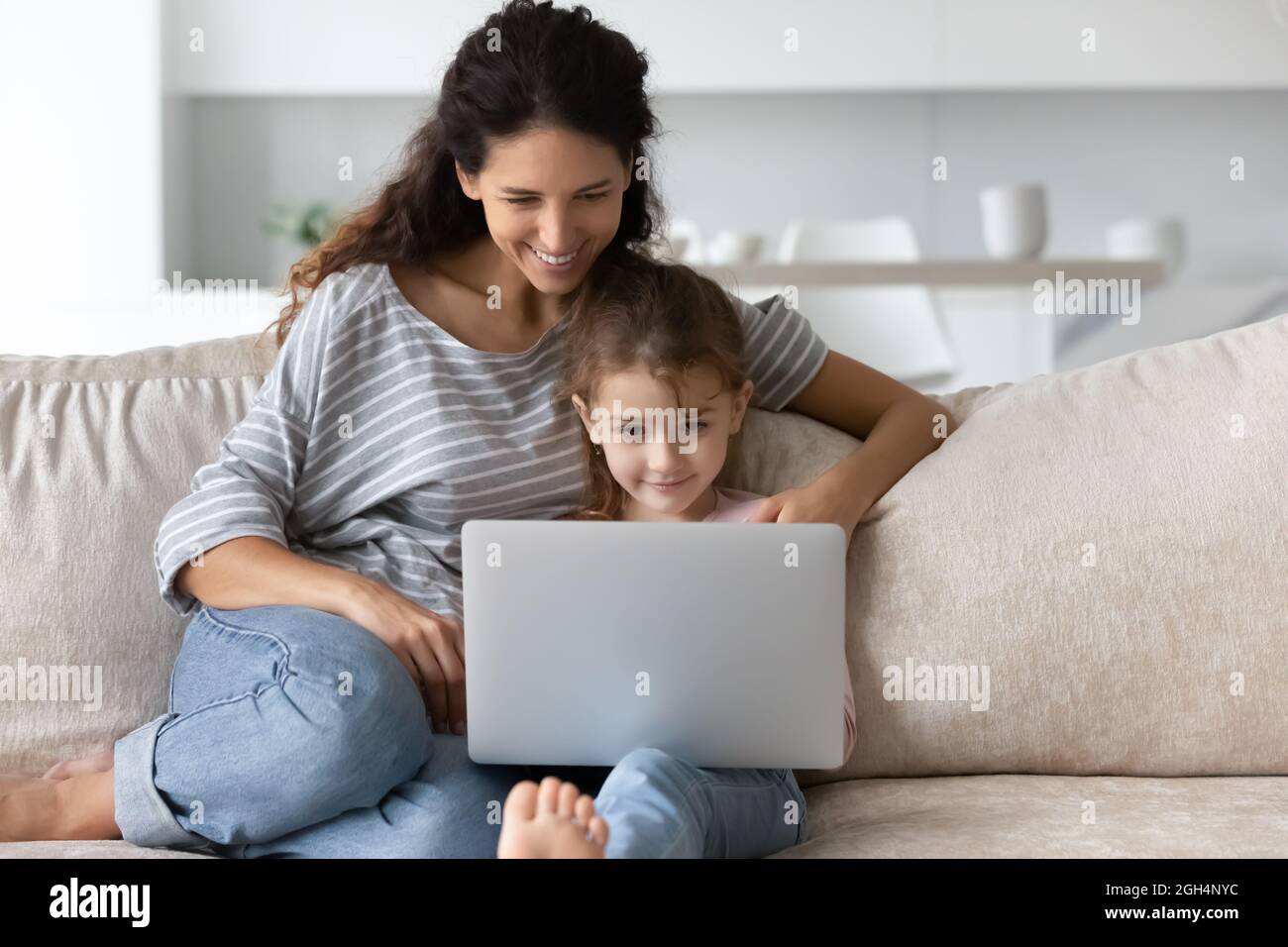 Bonding happy family using computer applications at home Stock Photo ...