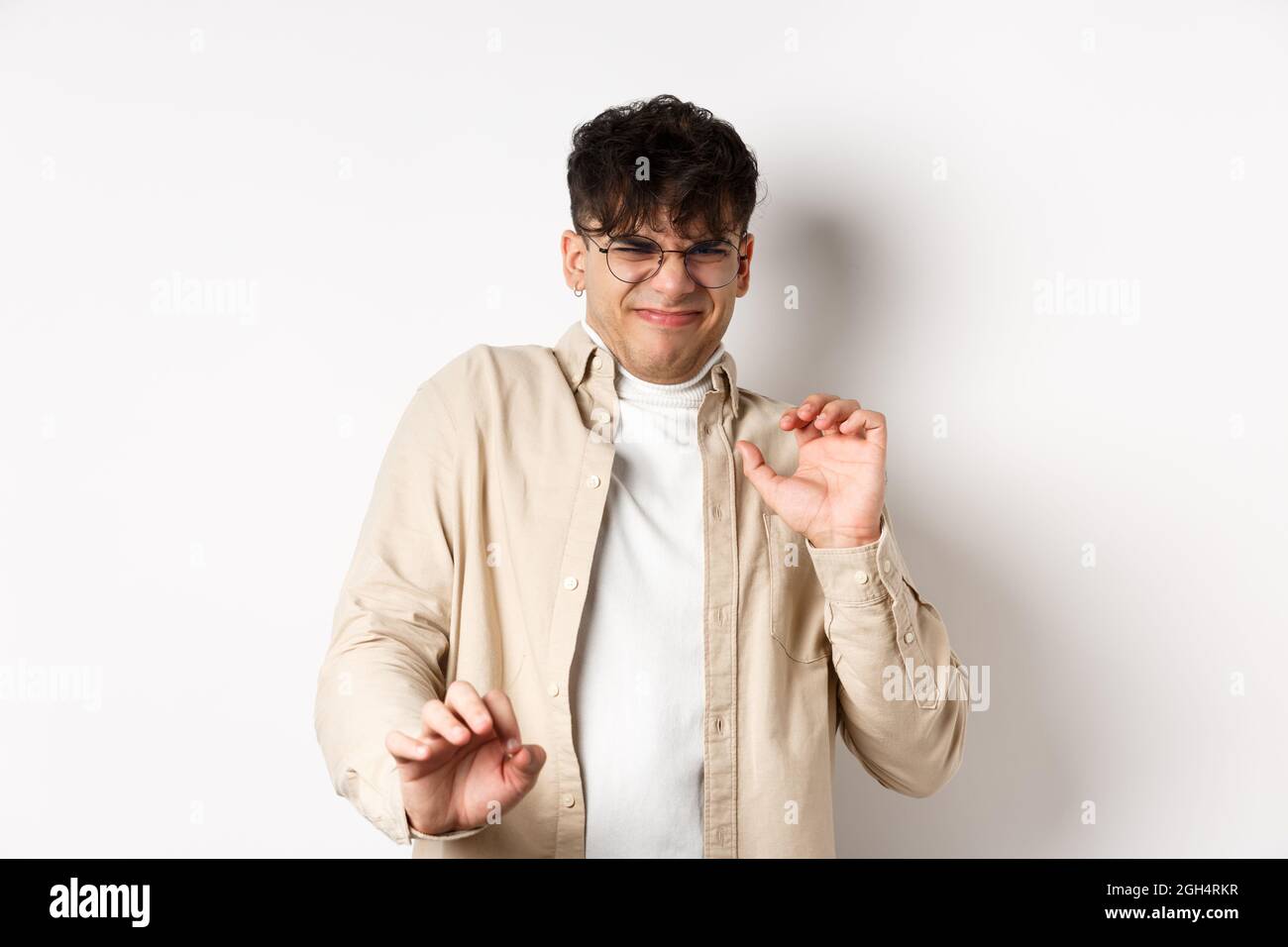 Disgusted guy grimacing and jumping away from something nasty, stare ...