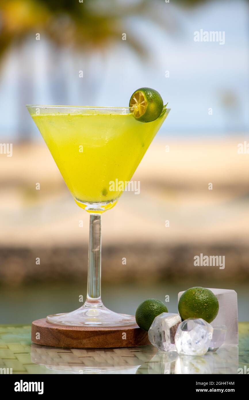 tropical martini with beach background Stock Photo - Alamy
