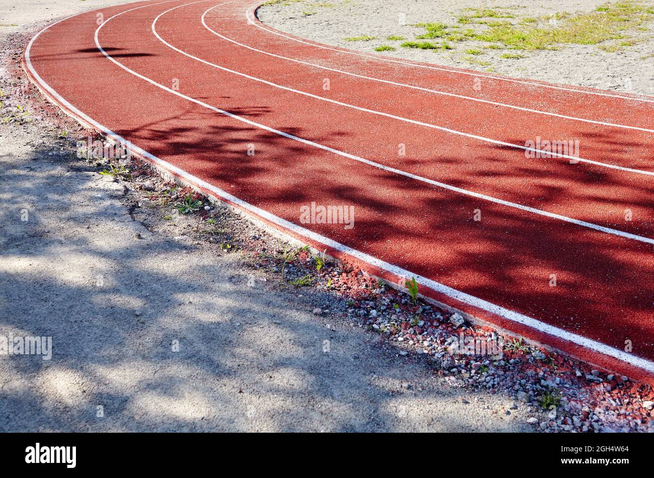 Red treadmill on sport field. Running track on the stadium Stock Photo ...