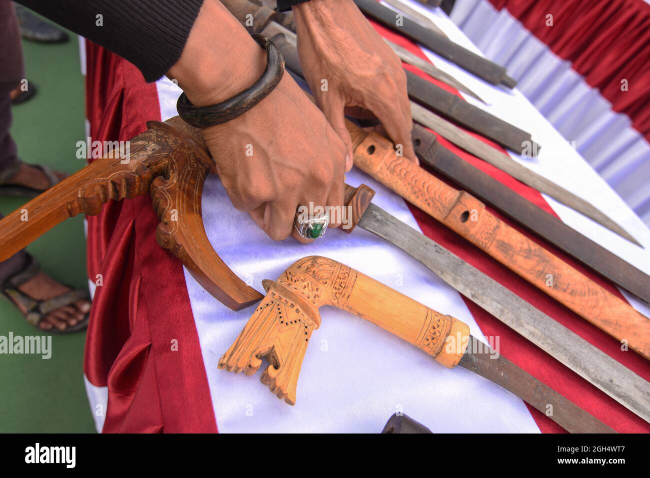 Palu, Indonesia. 05th Sep, 2021. A visitor tries to use a traditional ...