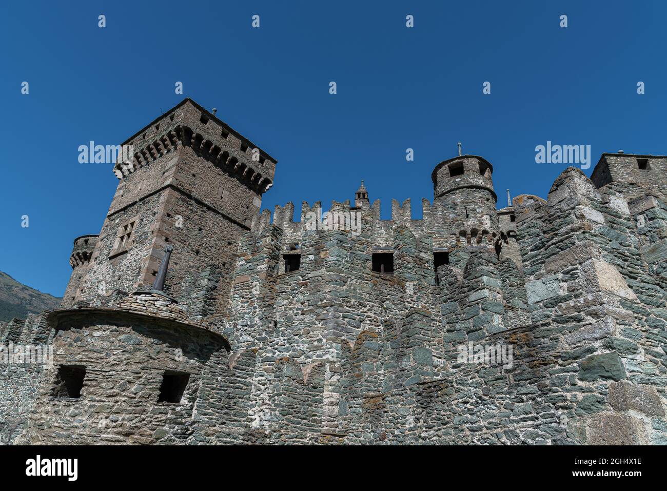 The castle of Fénis, located in the municipality of the same name, is ...