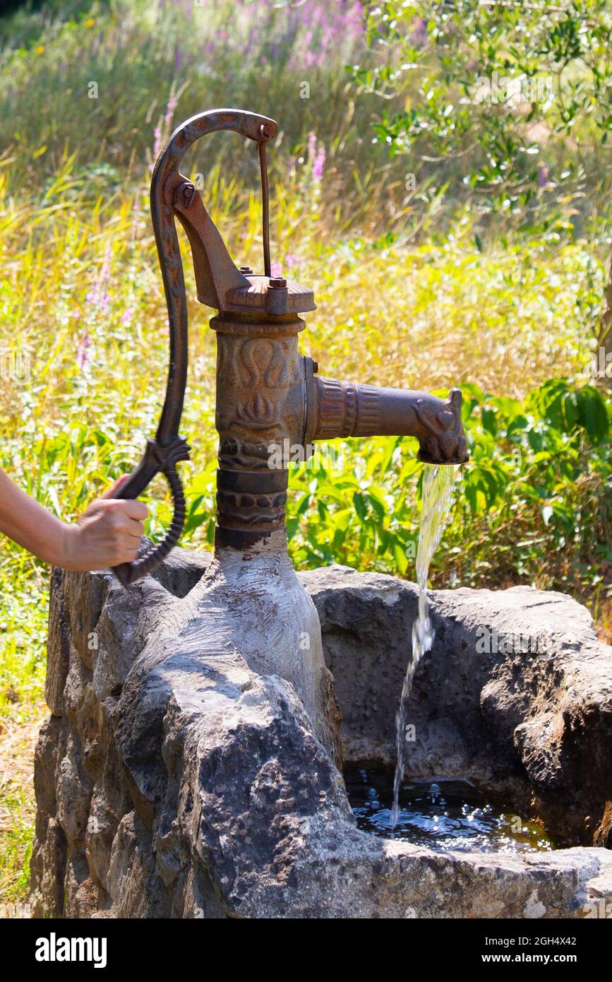 fountain with Mountain spring water in the mountains Stock Photo - Alamy
