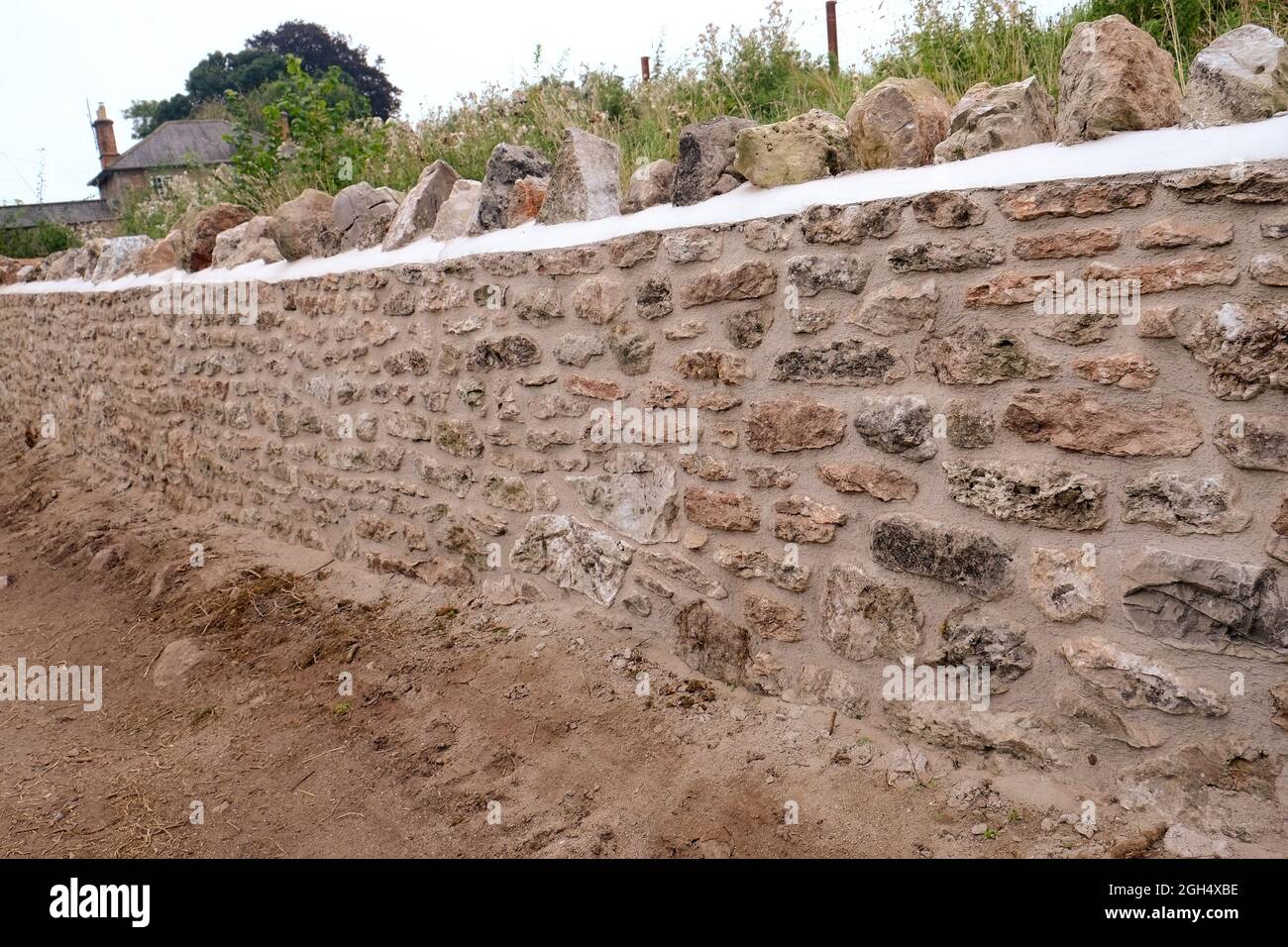 September 2021 - New stone wall being built in a traditional style ...