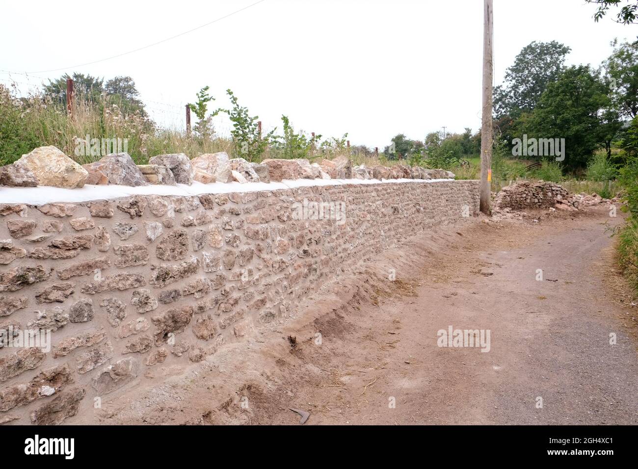 September 2021 - New stone wall being built in a traditional style ...