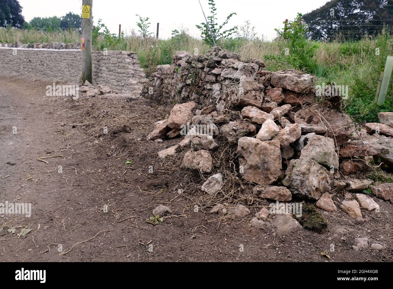 September 2021 - New stone wall being built in a traditional style ...