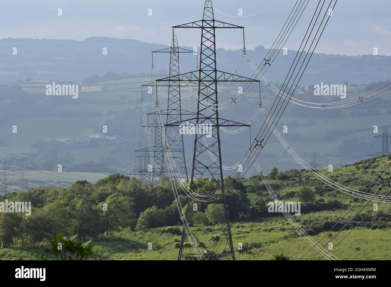 A landscape photograph with electricity Pylons Stock Photo - Alamy