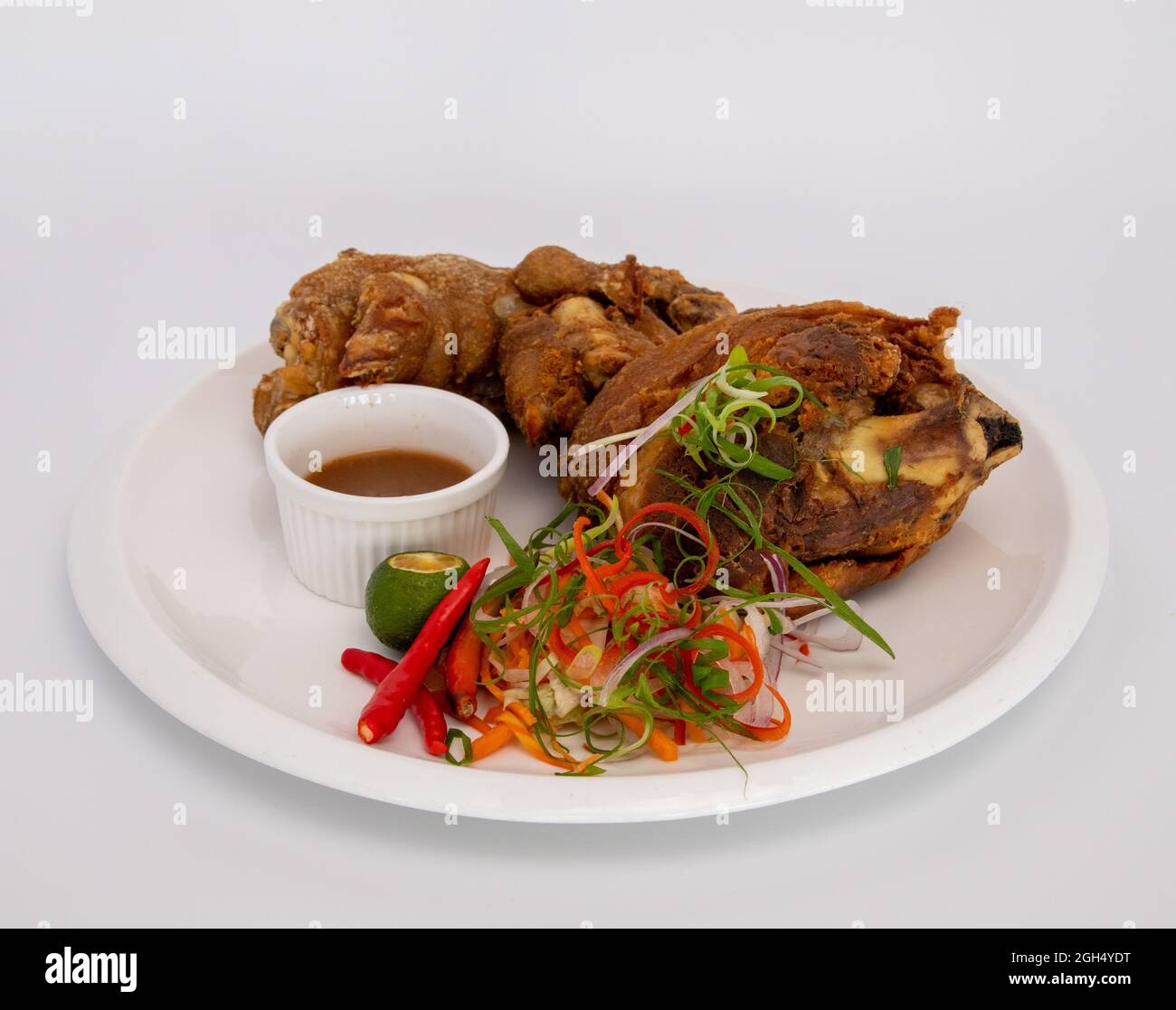 crispy pata, deep-fried pork knuckle Stock Photo - Alamy