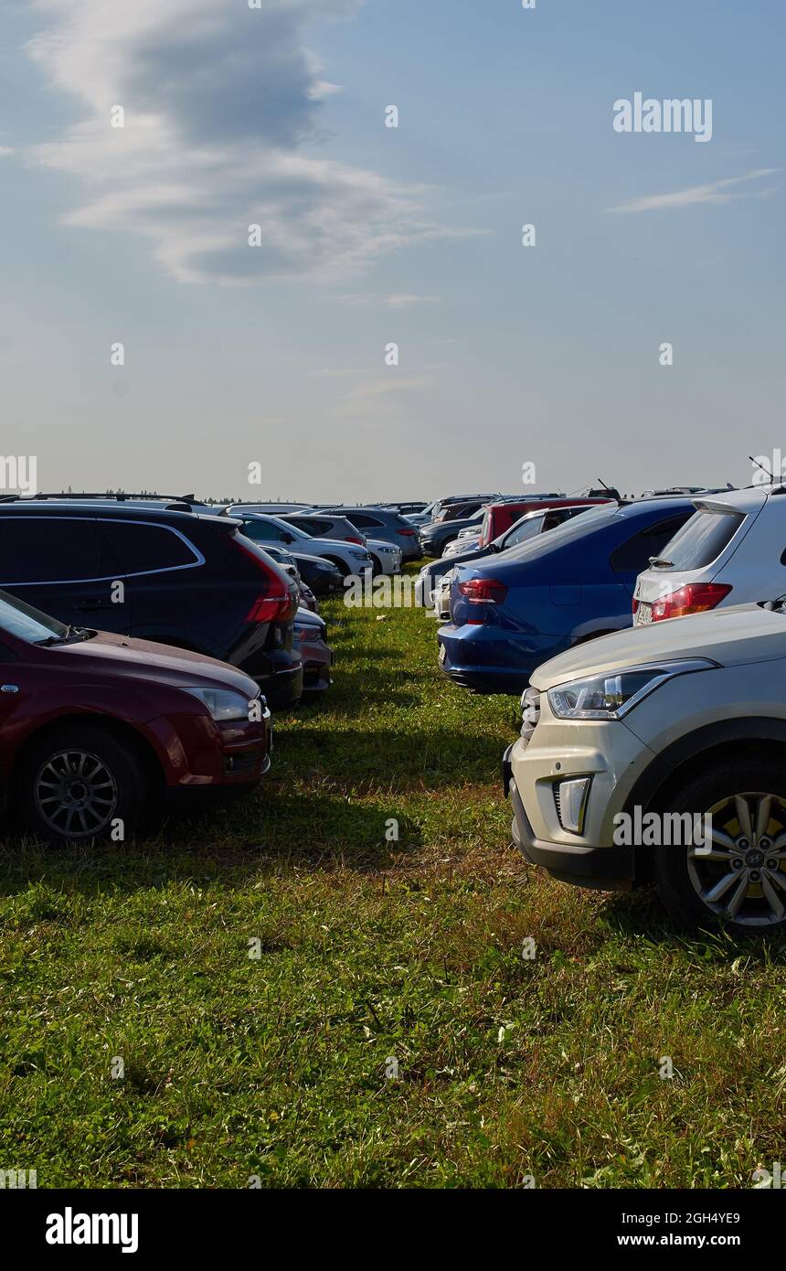 The space between the cars parked on the lawn Stock Photo - Alamy
