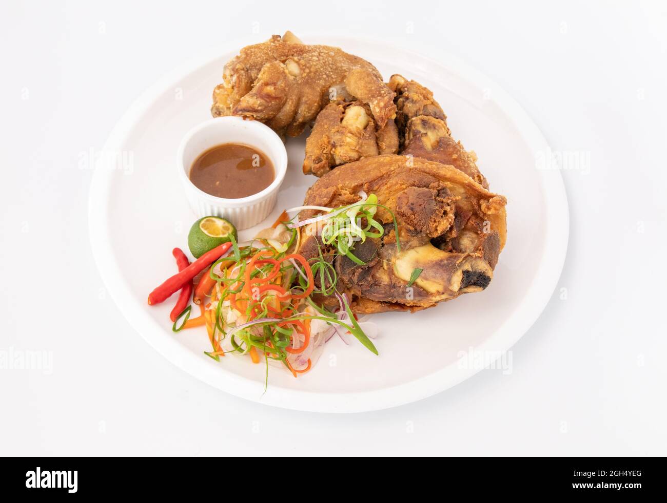 crispy pata, deep-fried pork knuckle Stock Photo - Alamy