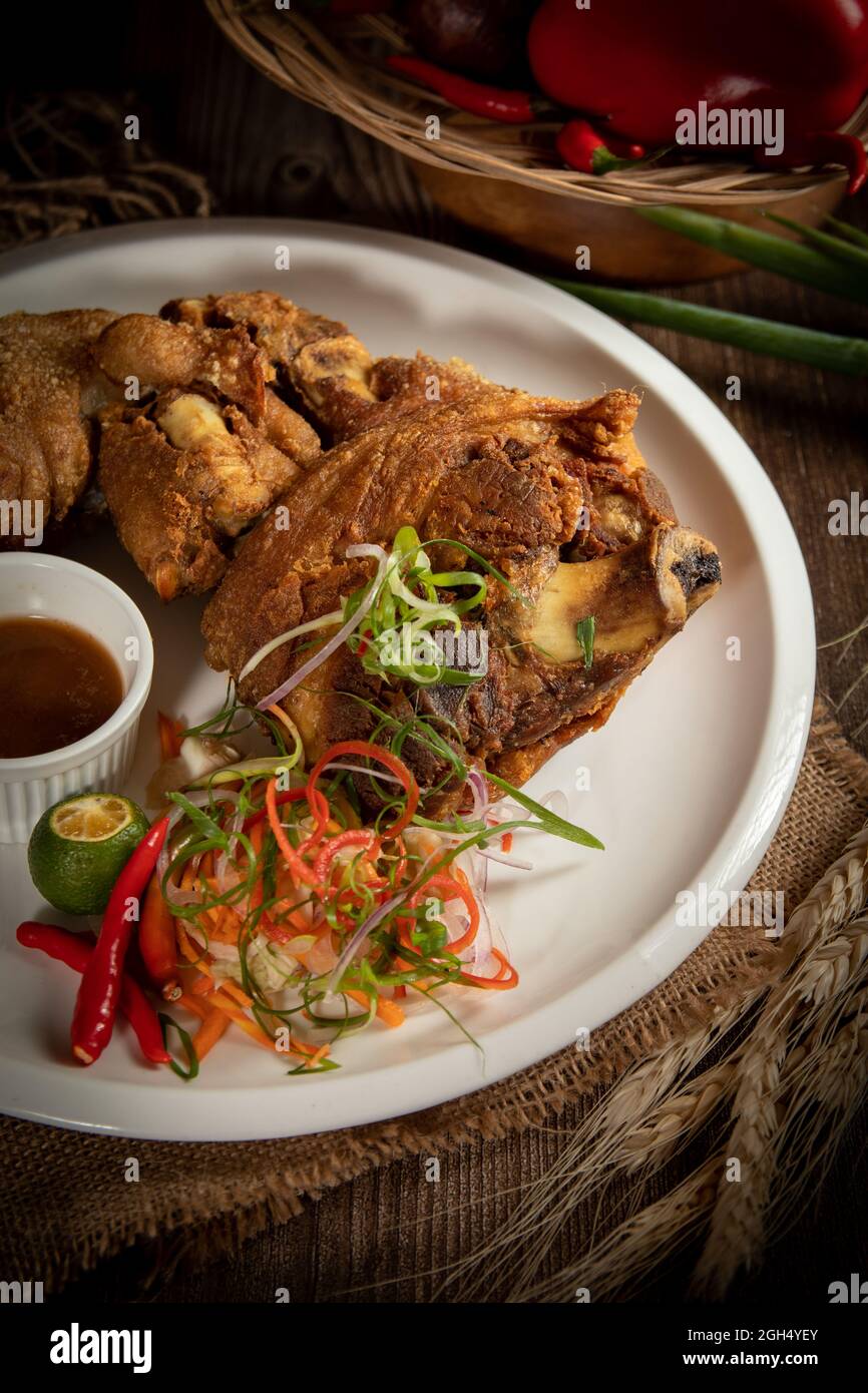 crispy pata, deep-fried pork knuckle Stock Photo - Alamy