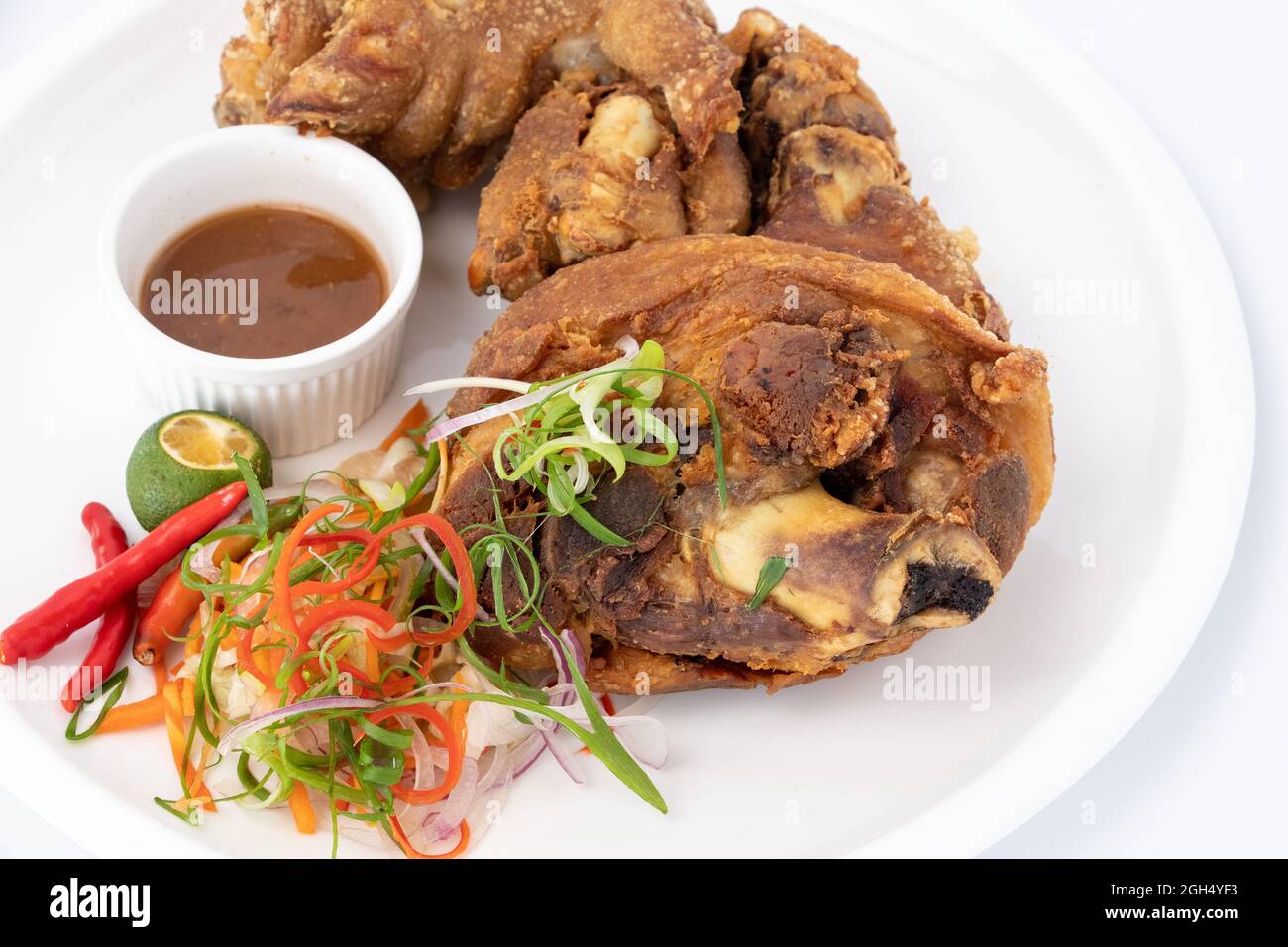 crispy pata, deep-fried pork knuckle Stock Photo - Alamy