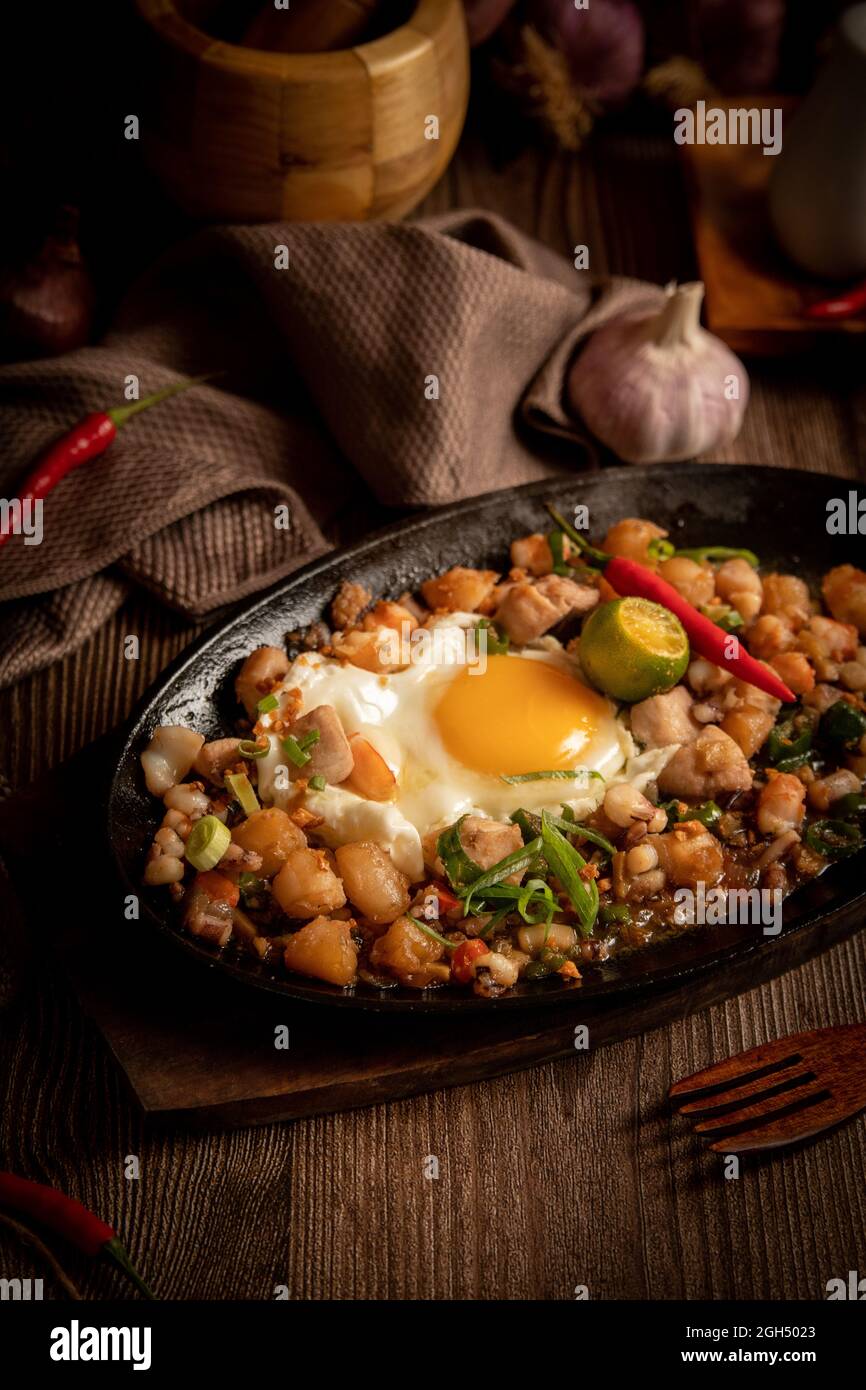 sizzling pork sisig Stock Photo - Alamy
