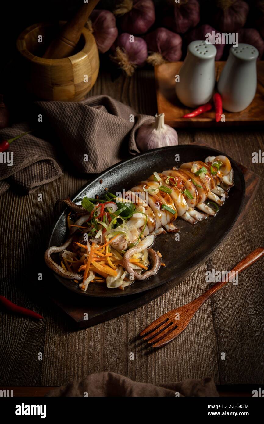 Sizzling grilled squid hi-res stock photography and images - Alamy