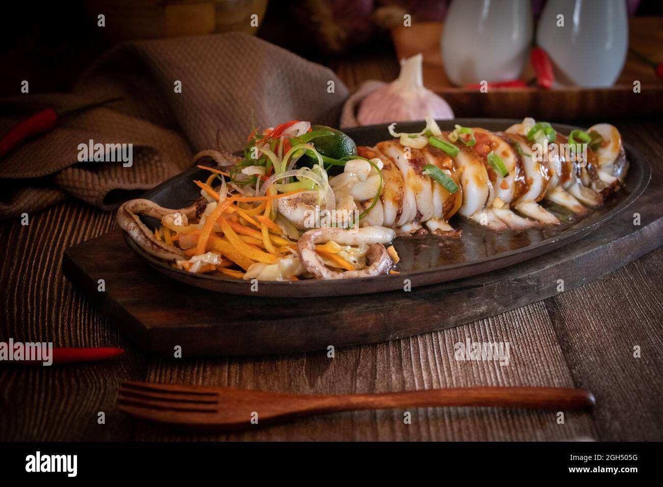 Sizzling grilled squid hi-res stock photography and images - Alamy