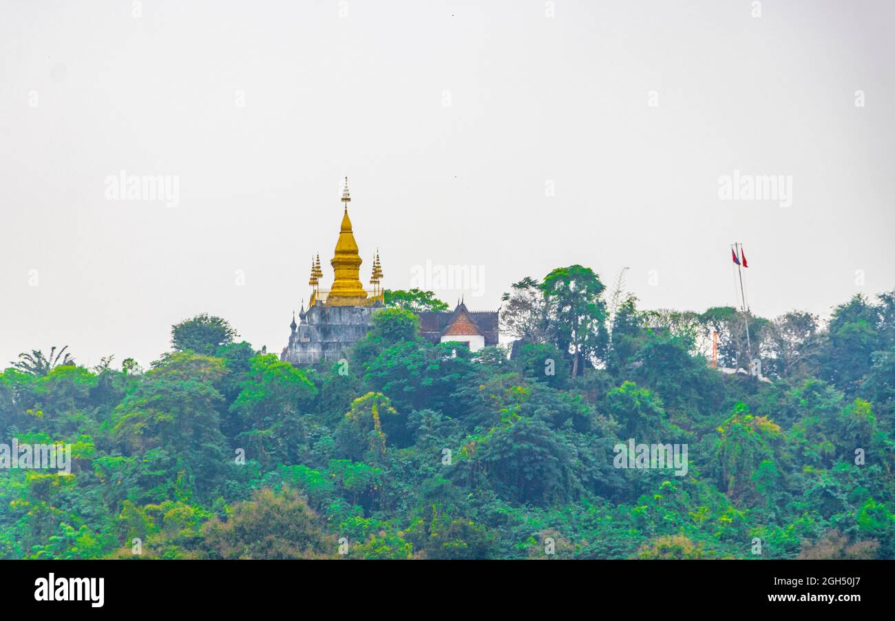 Mountain Phousi Hill and Wat Chom Si stupa landscape panorama in Luang ...
