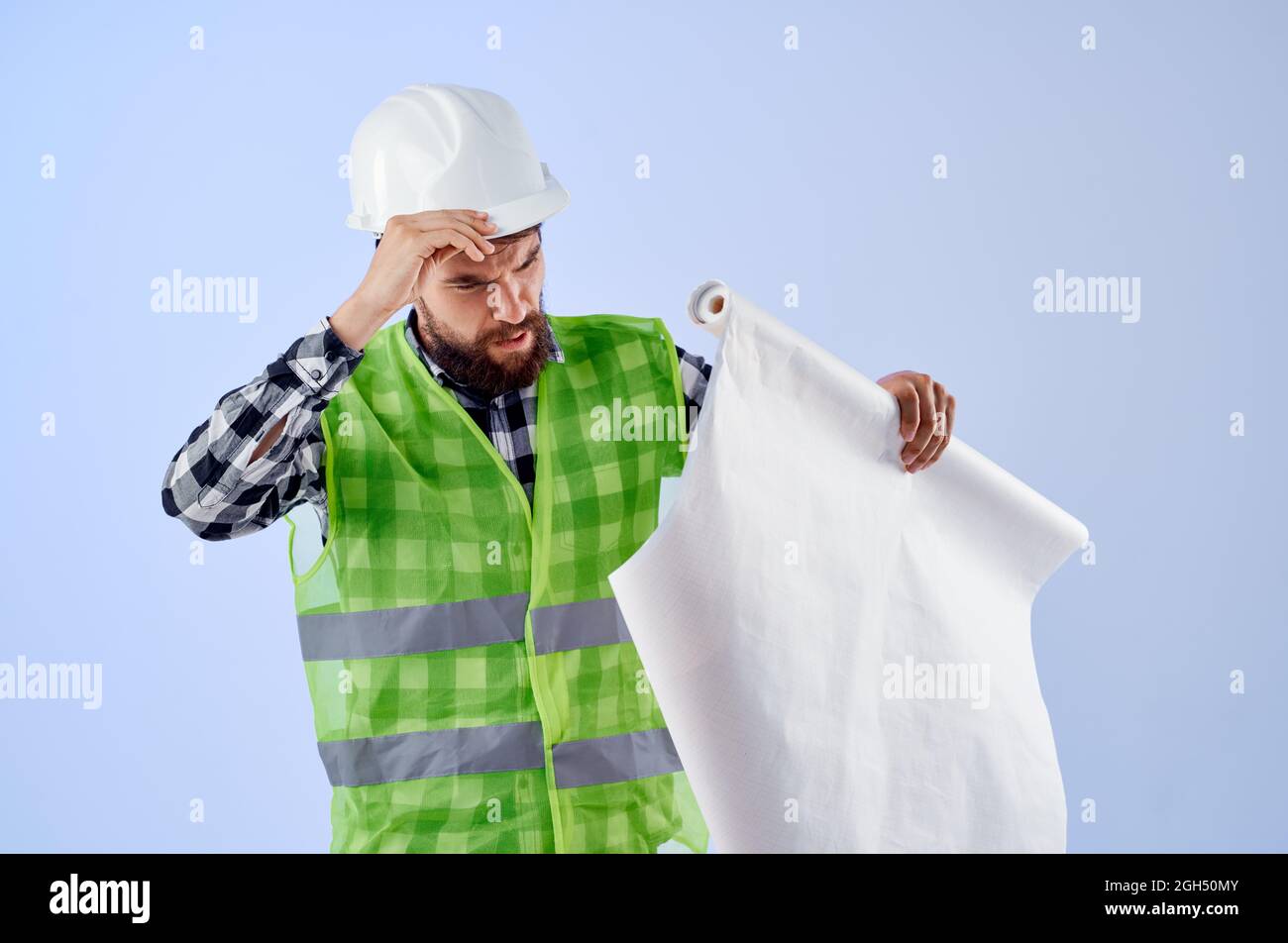 male builder in a white helmet blueprints Professional isolated ...