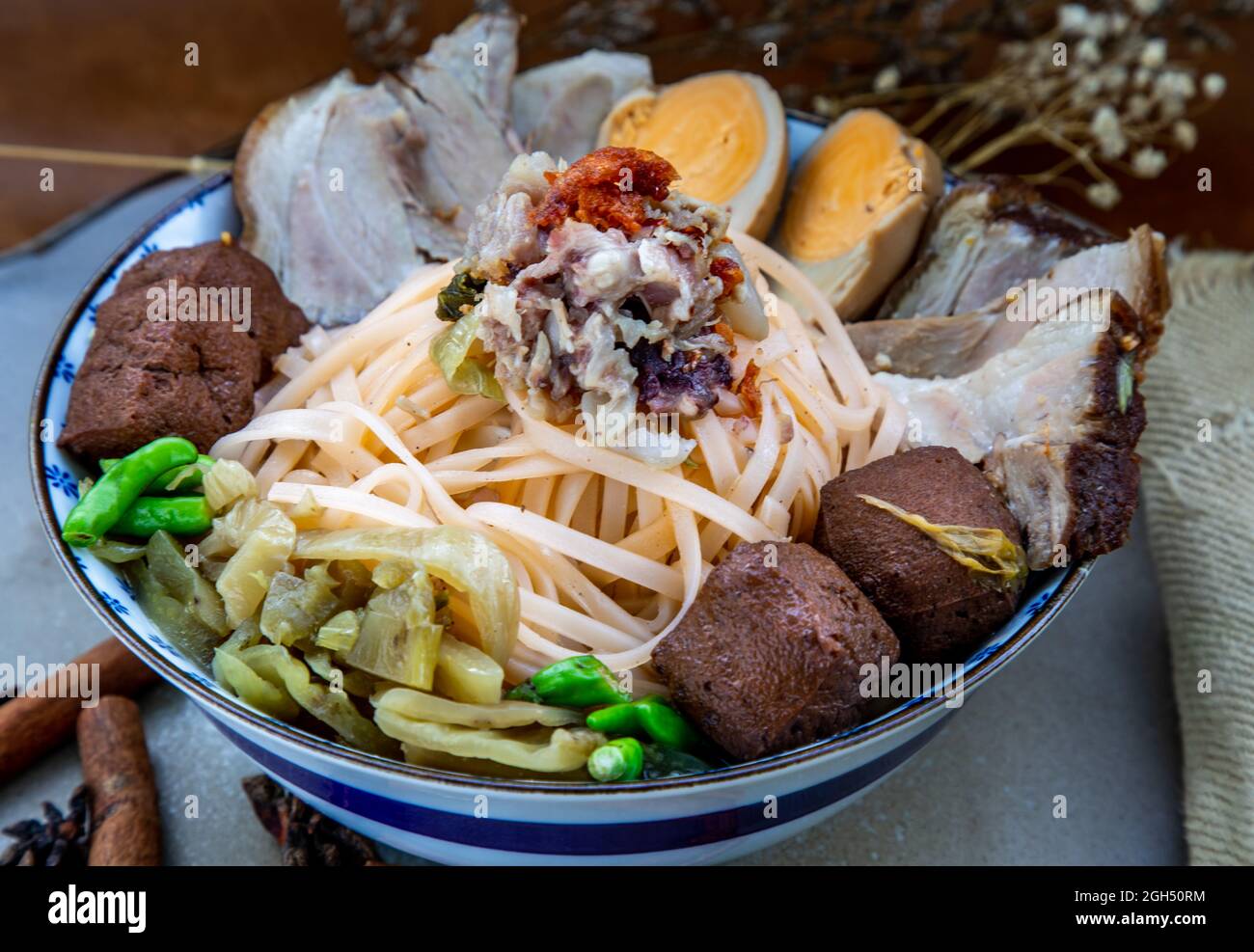 Traditional chinese Sliced stewed pork noodles with Pork bone broth and ...