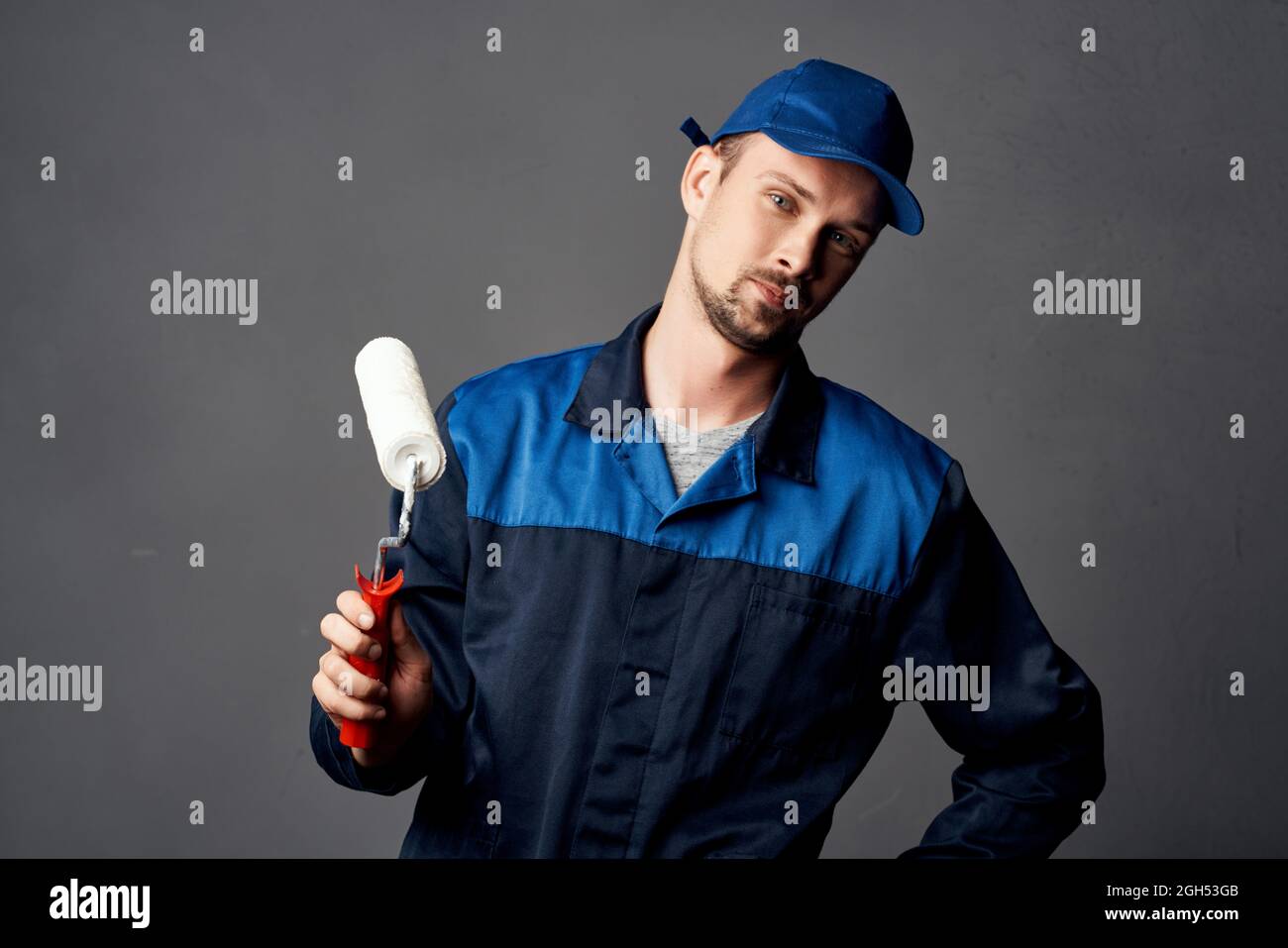 worker painter in construction form emotions studio posing Stock Photo ...