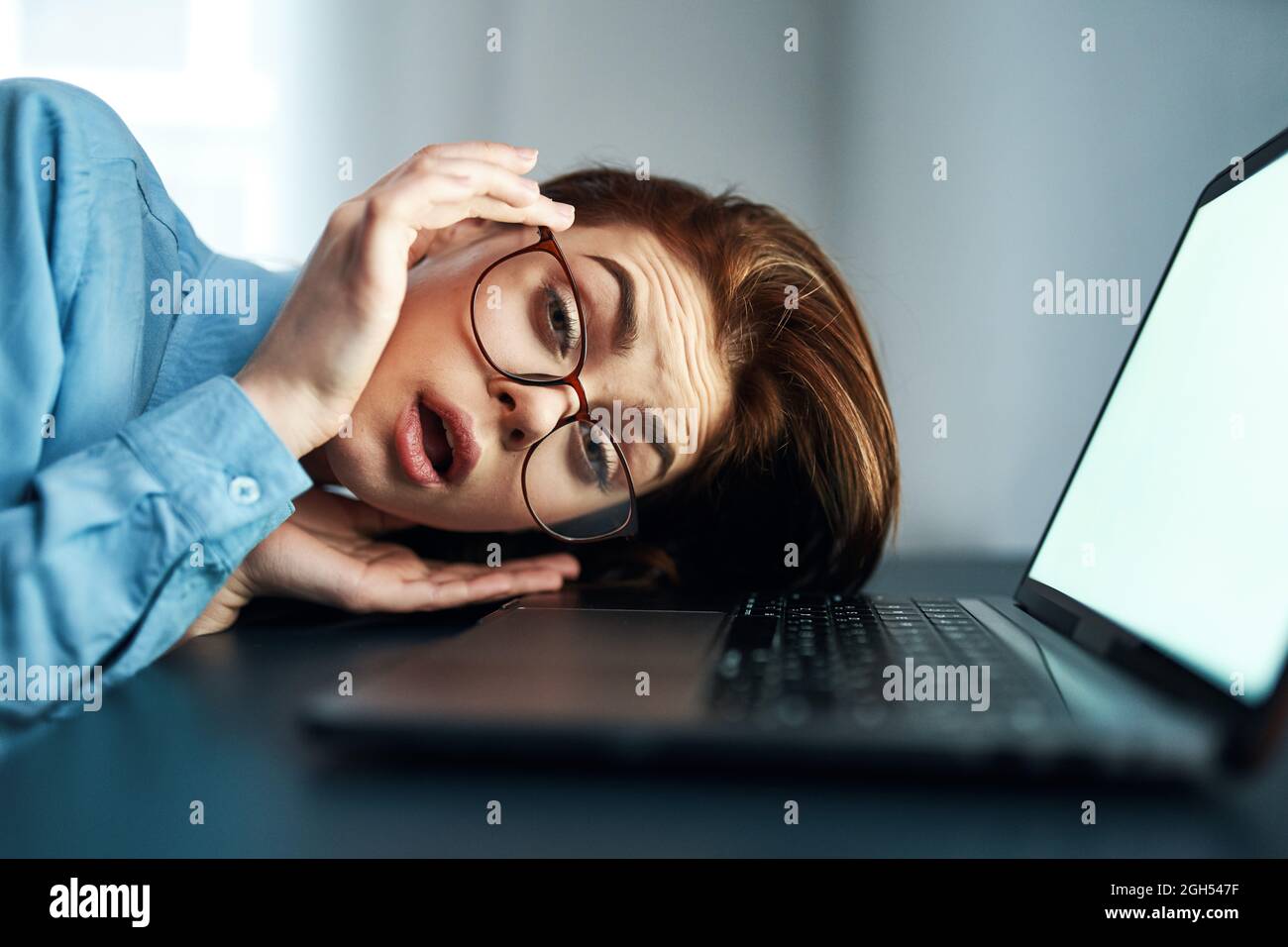 emotional woman in front of laptop at night work disorder Stock Photo ...