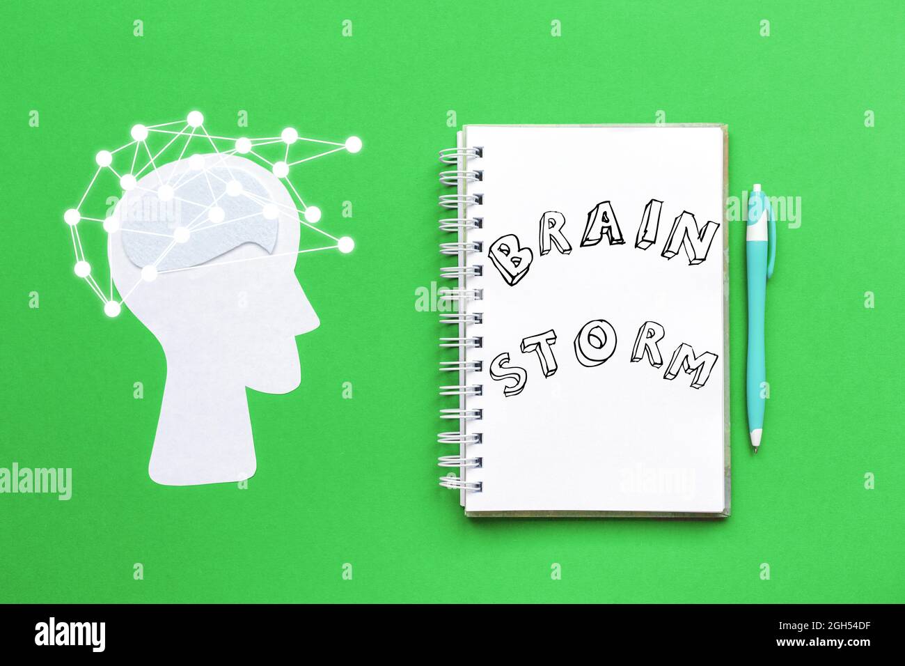 Brainstorming. A paper silhouette of a human's head thinking about a ...