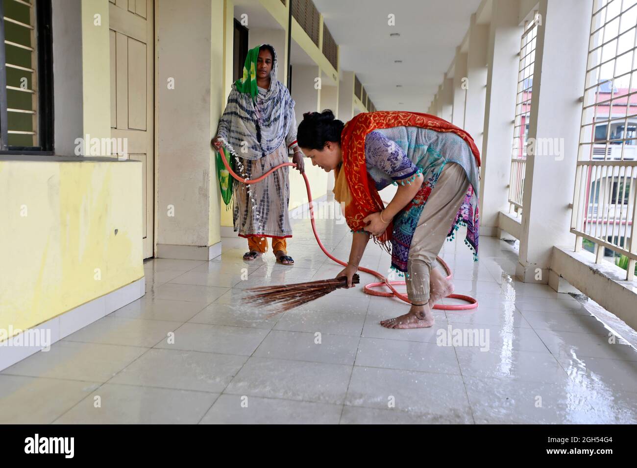 Dhaka, Bangladesh - September 05, 2021: Women are busy cleaning ...