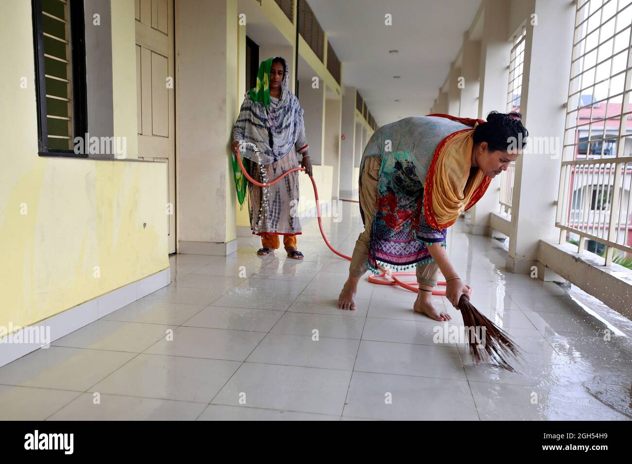 Dhaka, Bangladesh - September 05, 2021: Women are busy cleaning ...
